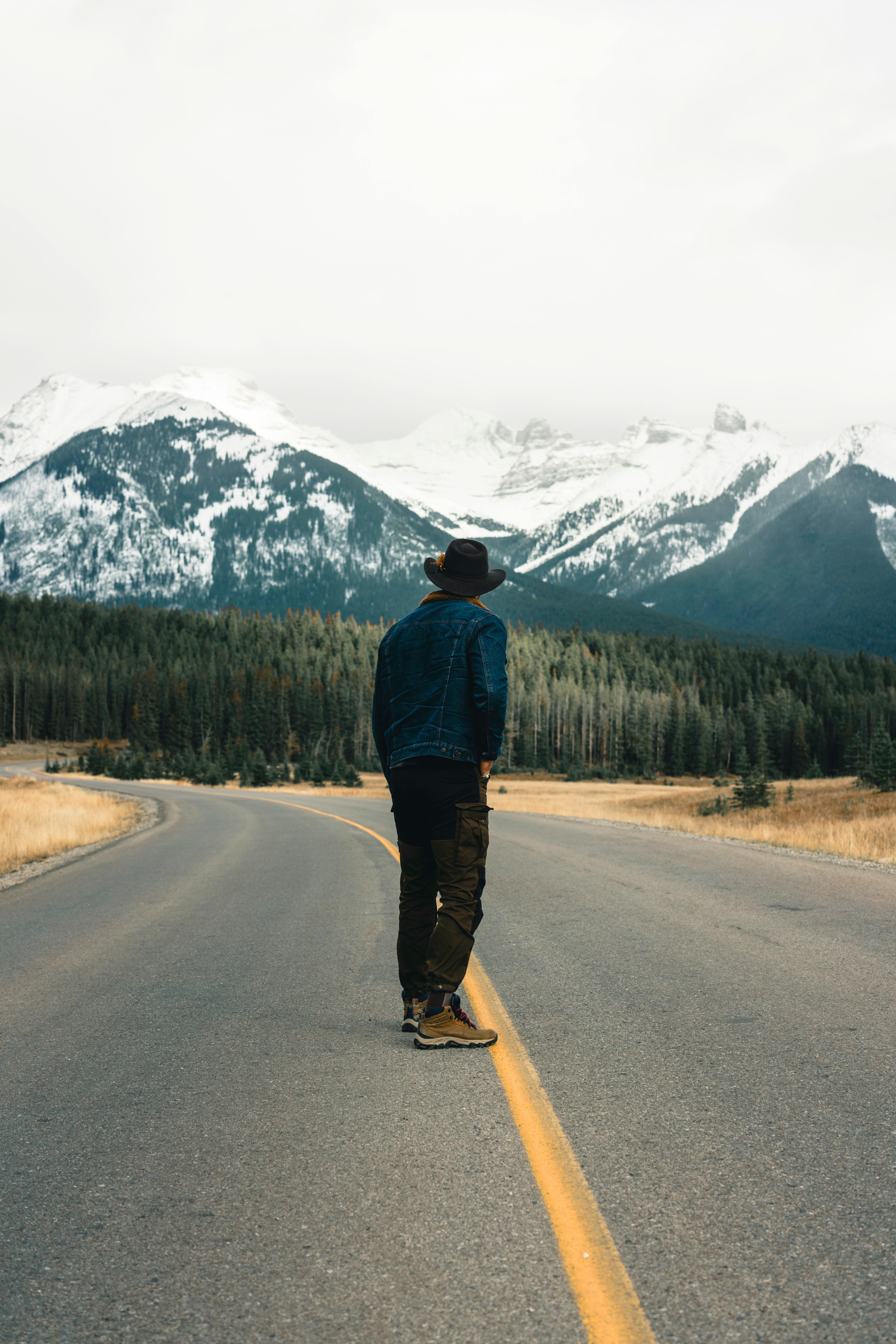 Man in Cowboy Hat and Jean Jacket Standing on Road in Countryside ...