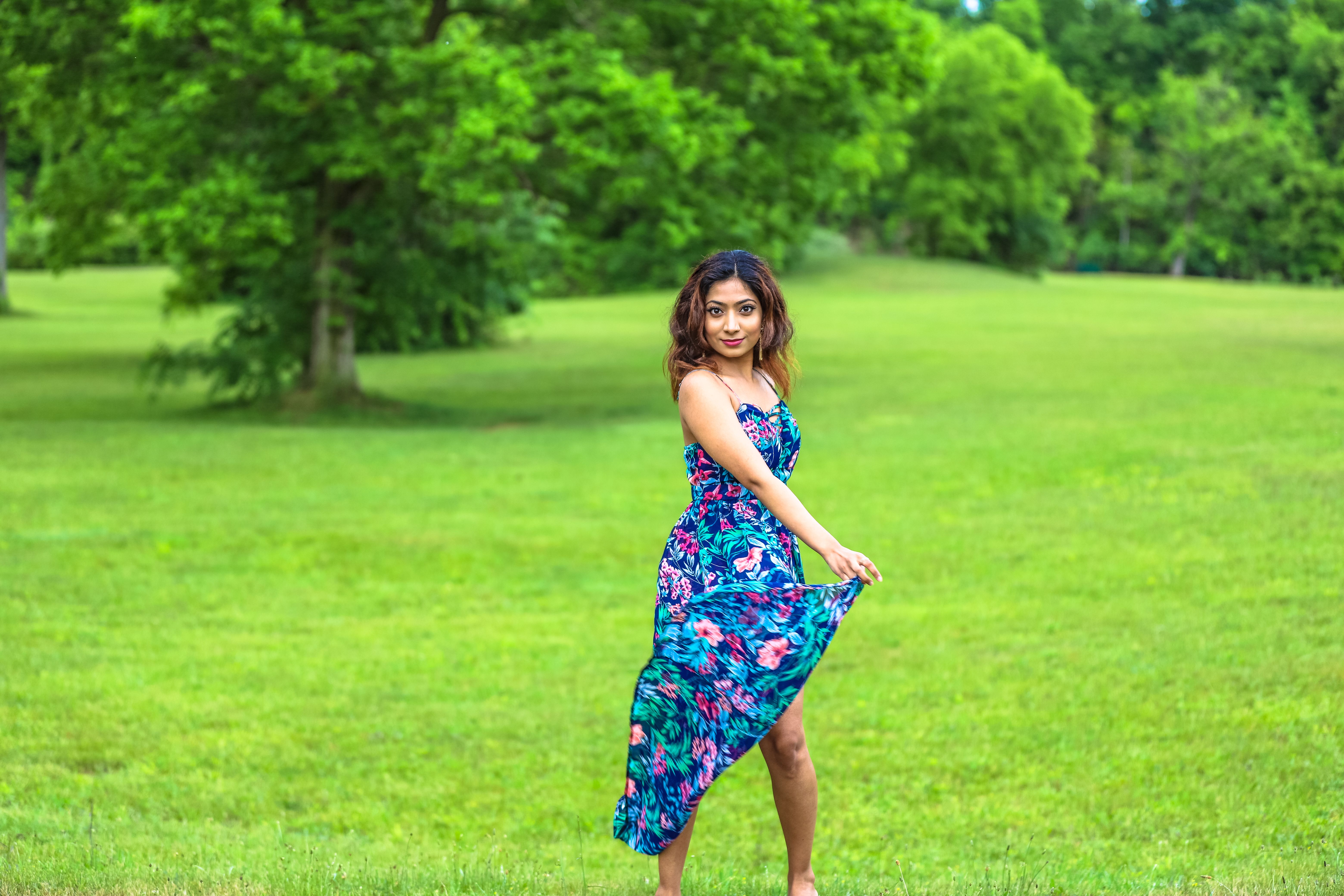 Brunette Woman in Blue Sundress on Meadow at Park · Free Stock Photo