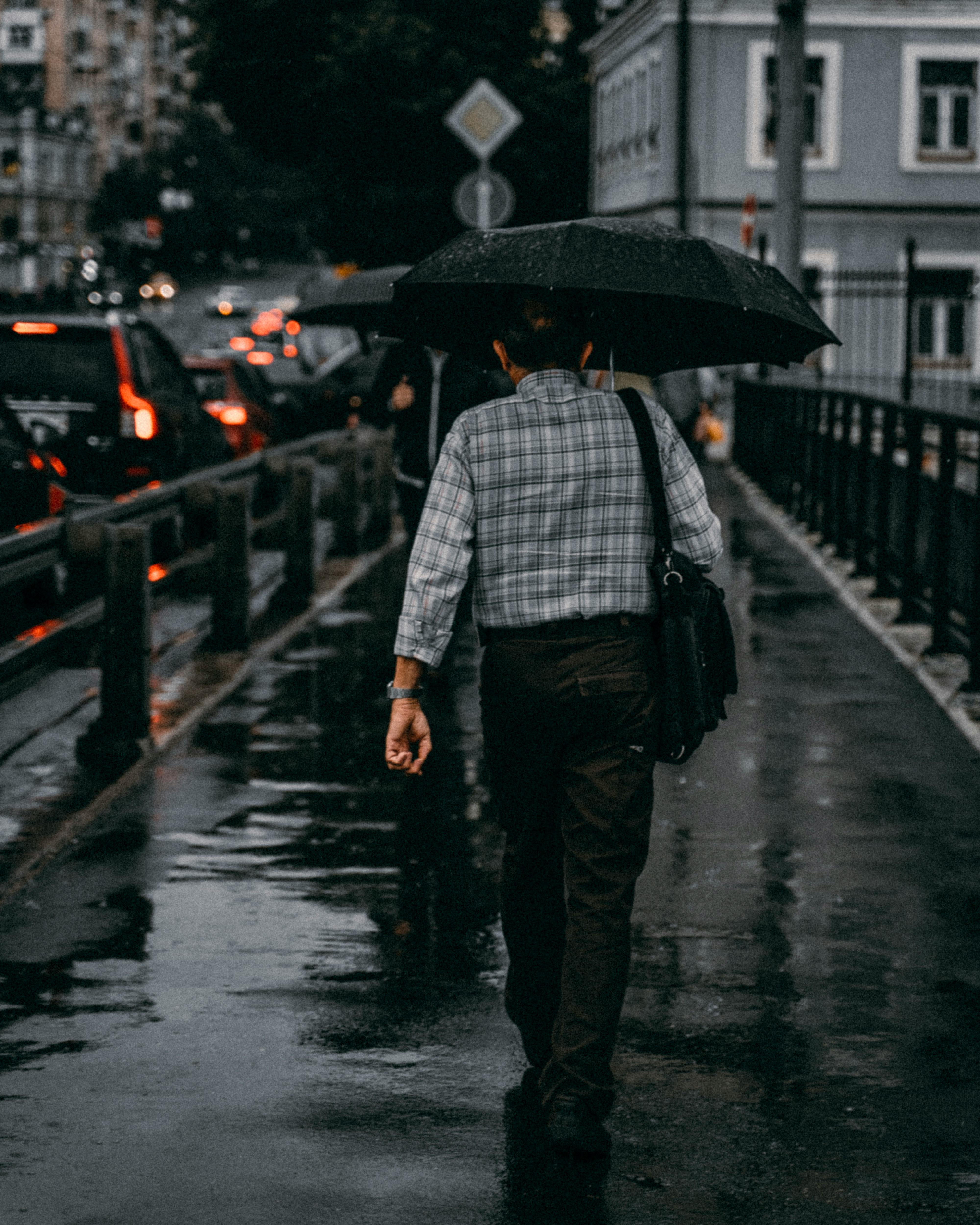 Man Walking With Umbrella · Free Stock Photo