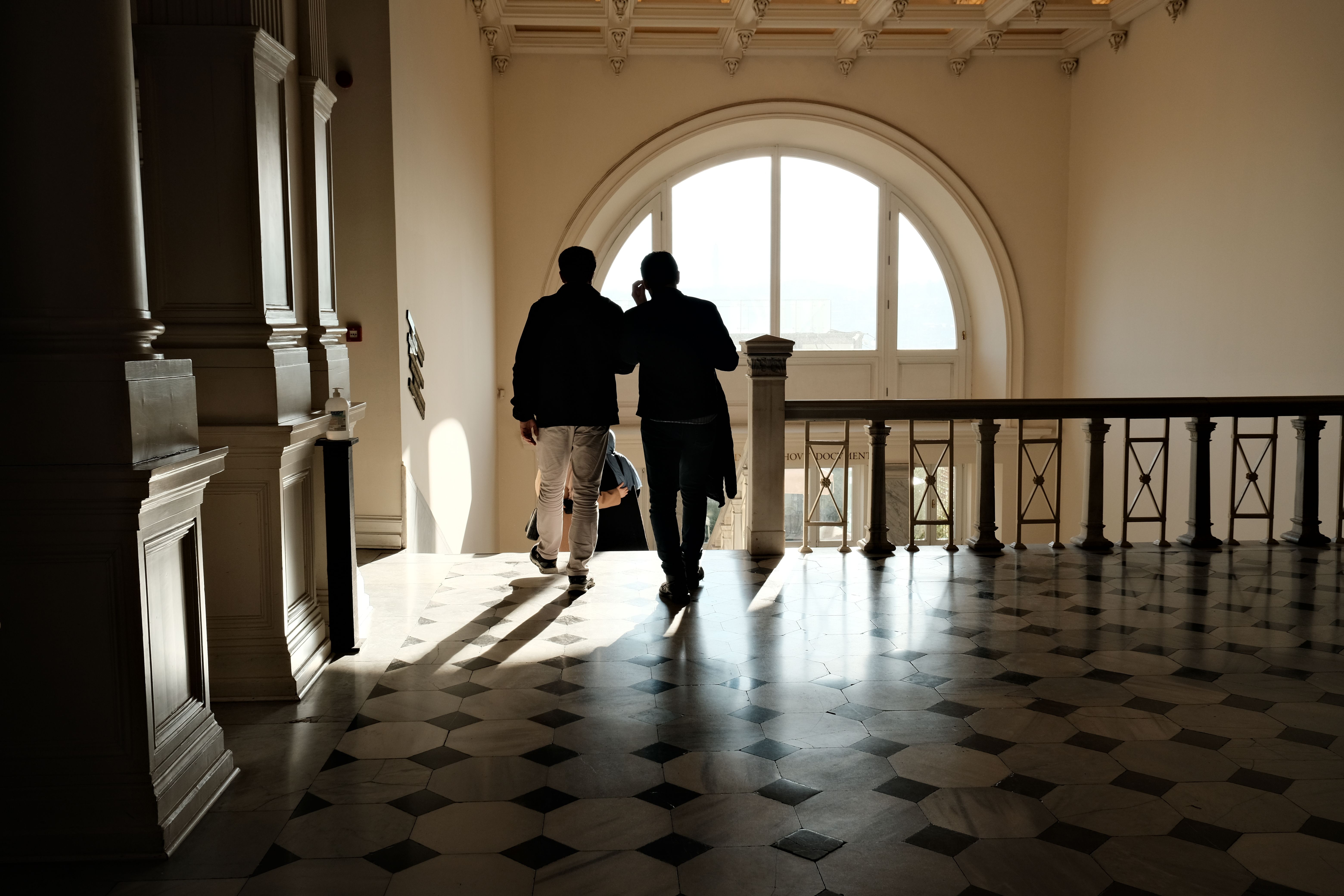 People on Staircase in Traditional Building · Free Stock Photo