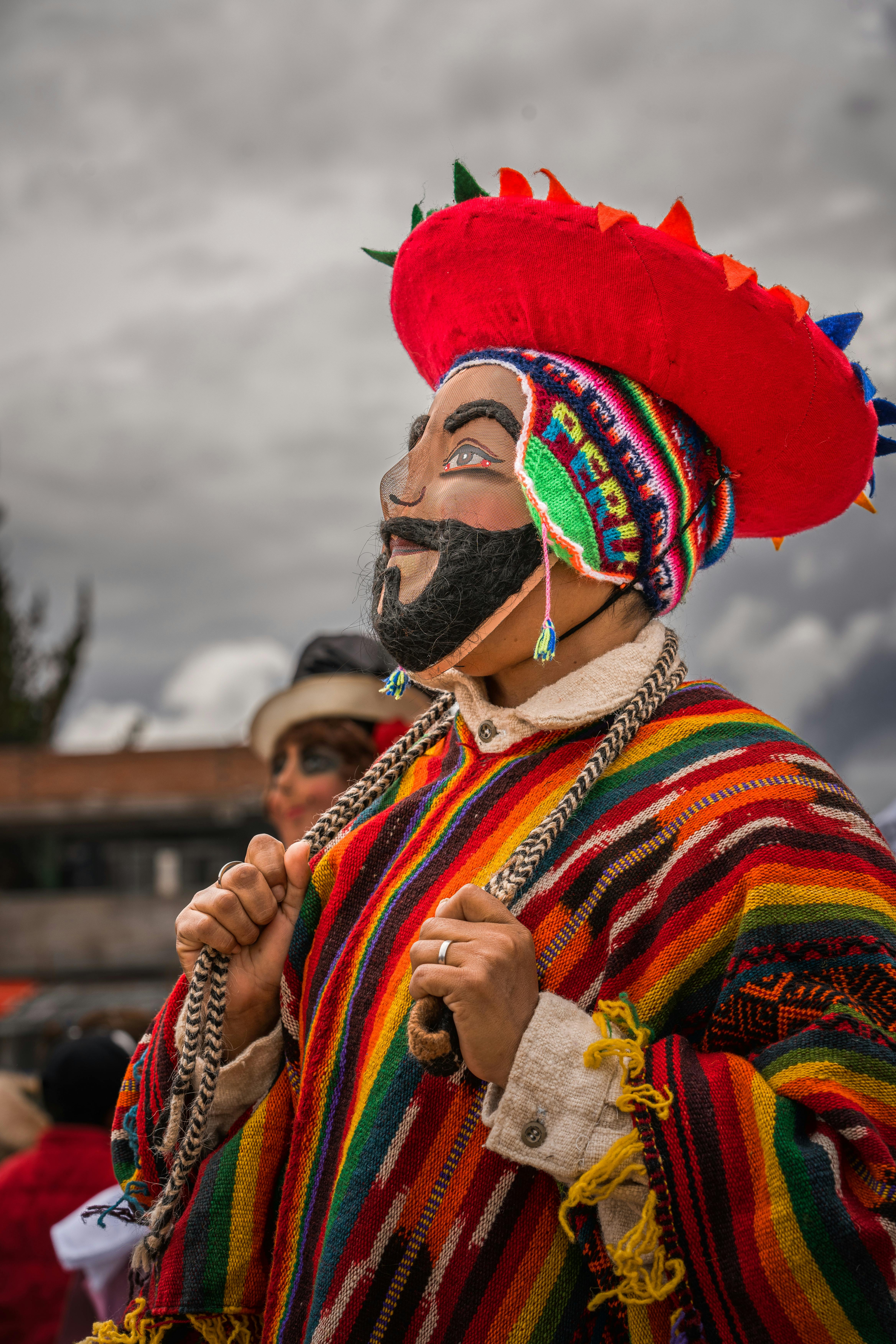 Portrait of Man Wearing a Mask on Parade · Free Stock Photo