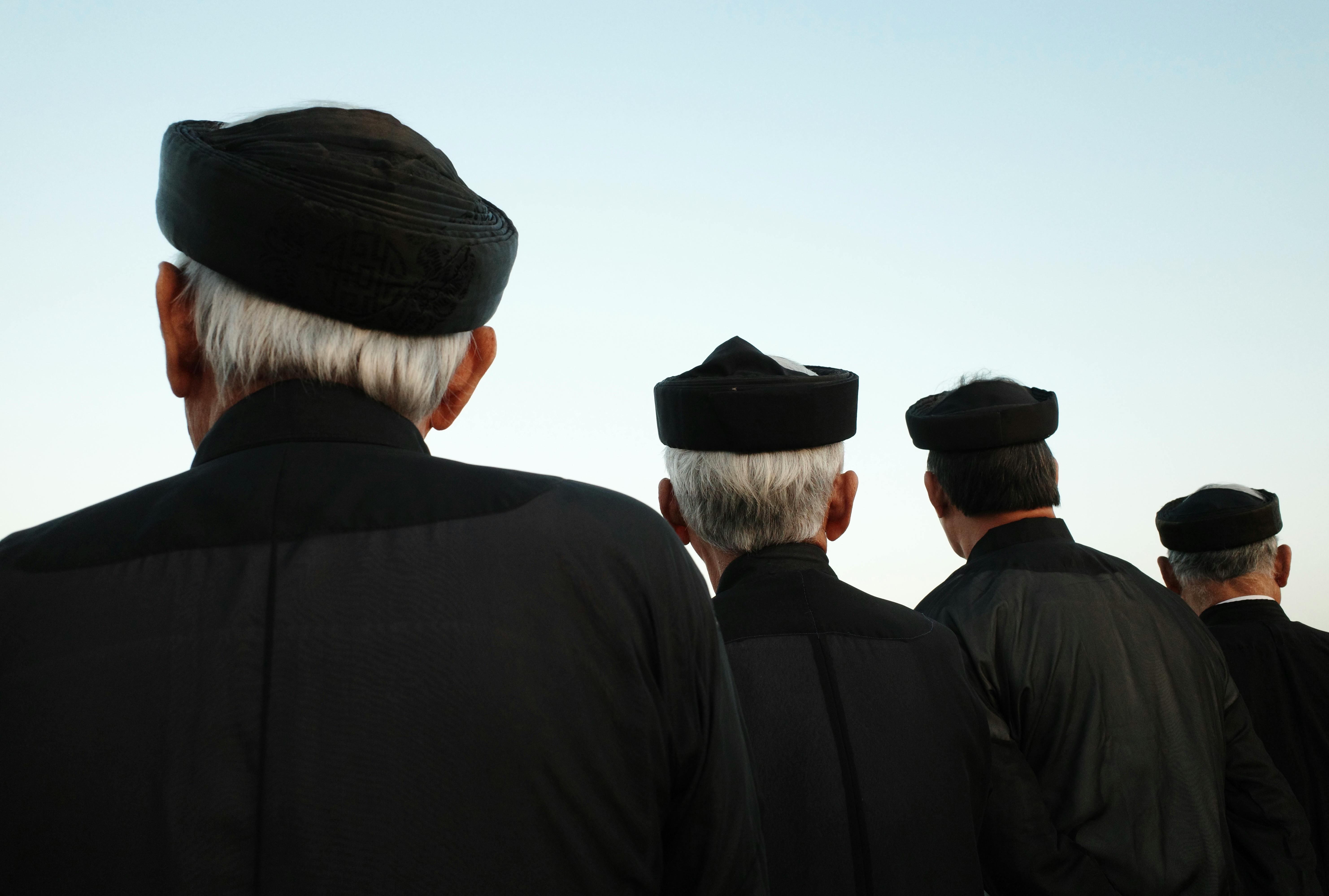 Group of Priest Looking in the Sky · Free Stock Photo