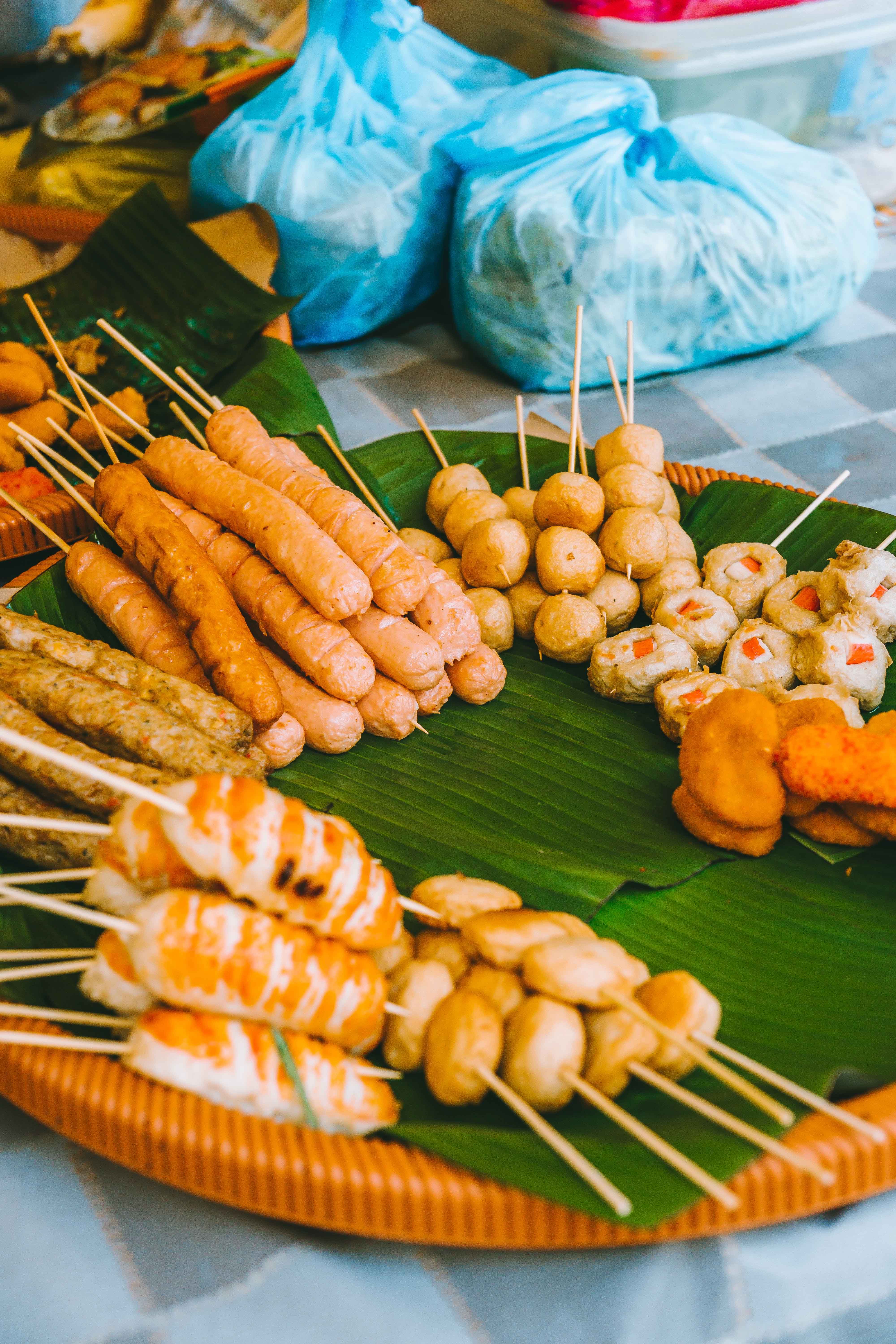 Tilt Shift Photography of Street Foods in Stick · Free Stock Photo