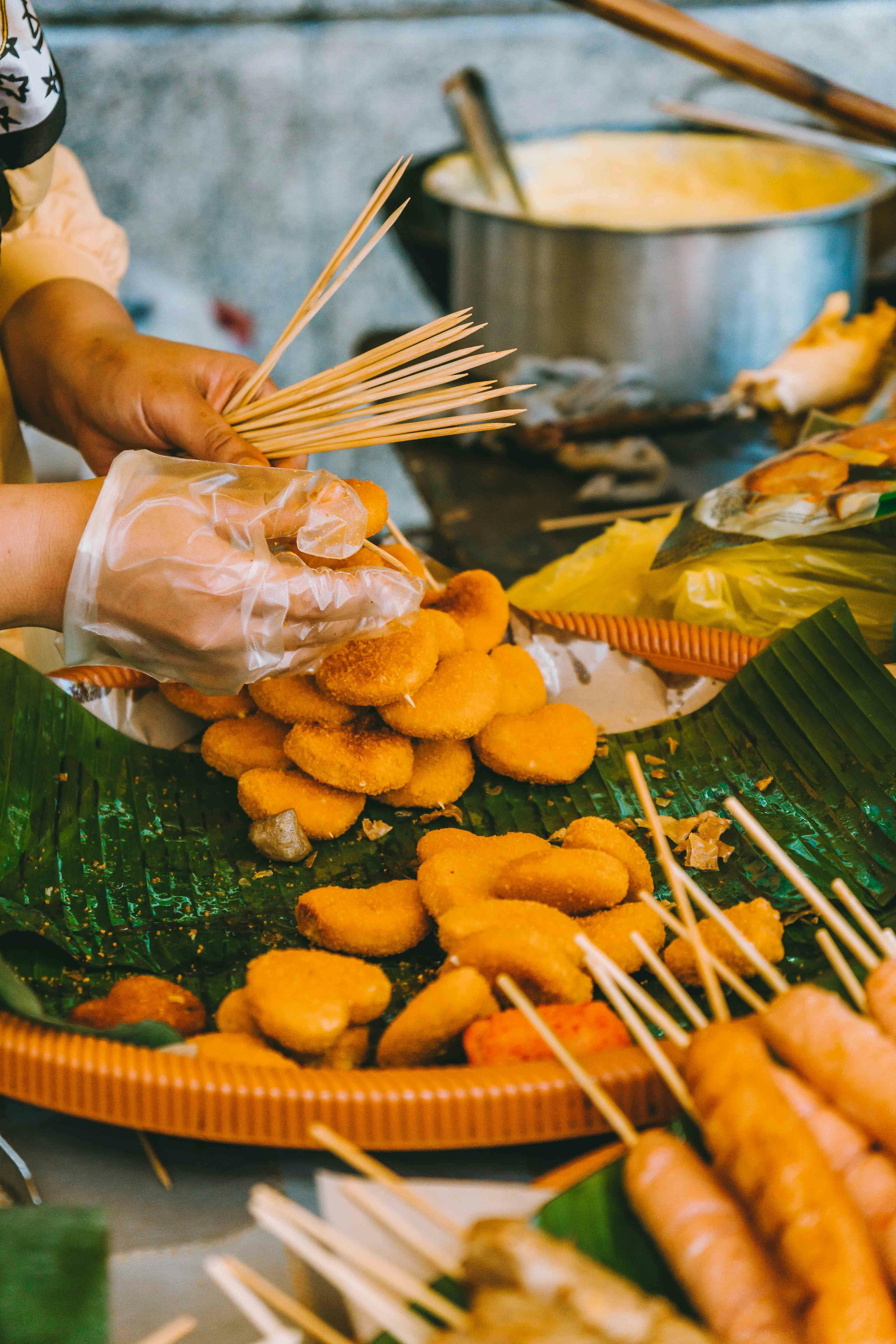 Man Preparing Meat in Food Booth · Free Stock Photo