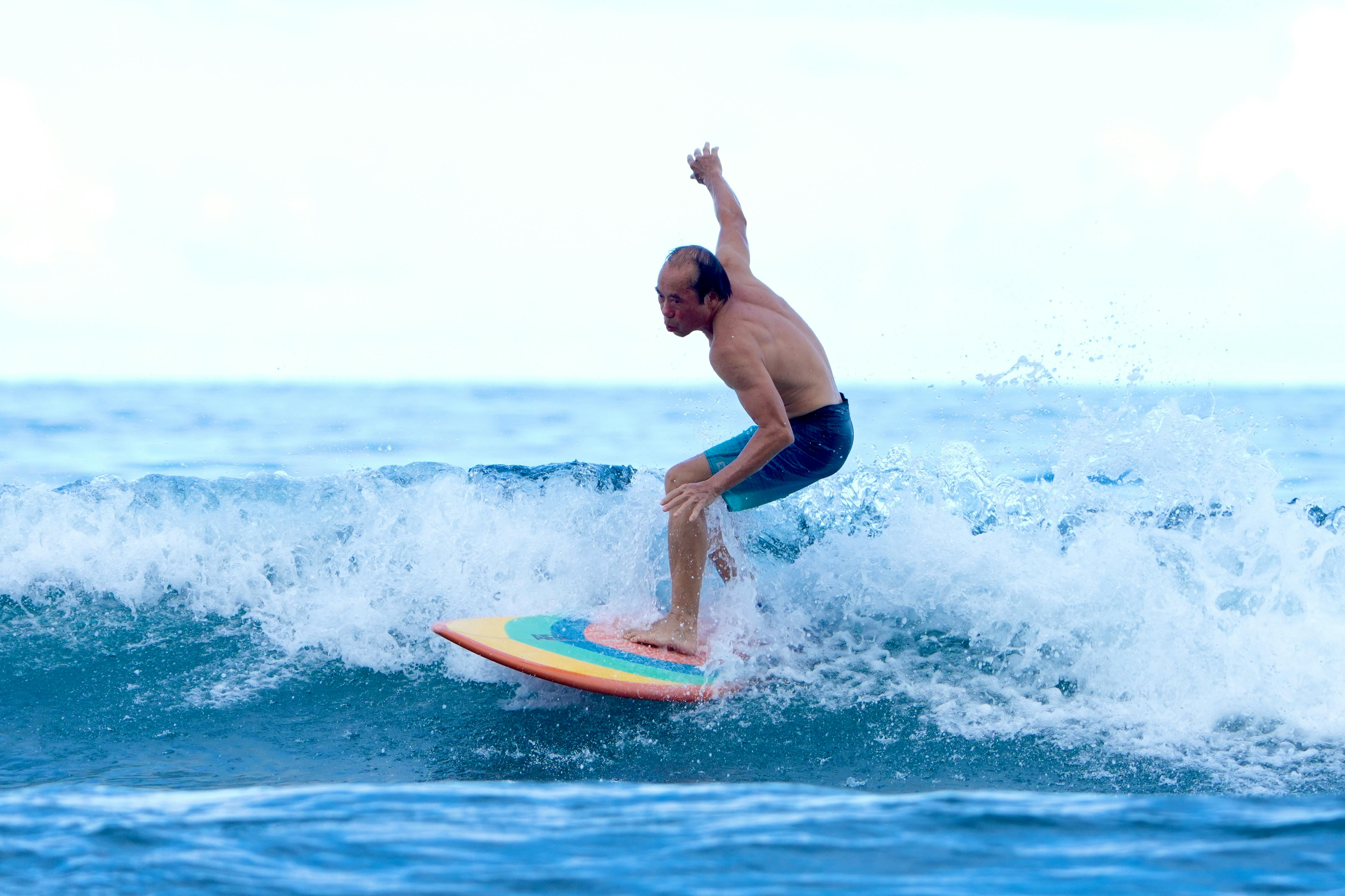 Surfer Balancing on a Surfboard · Free Stock Photo
