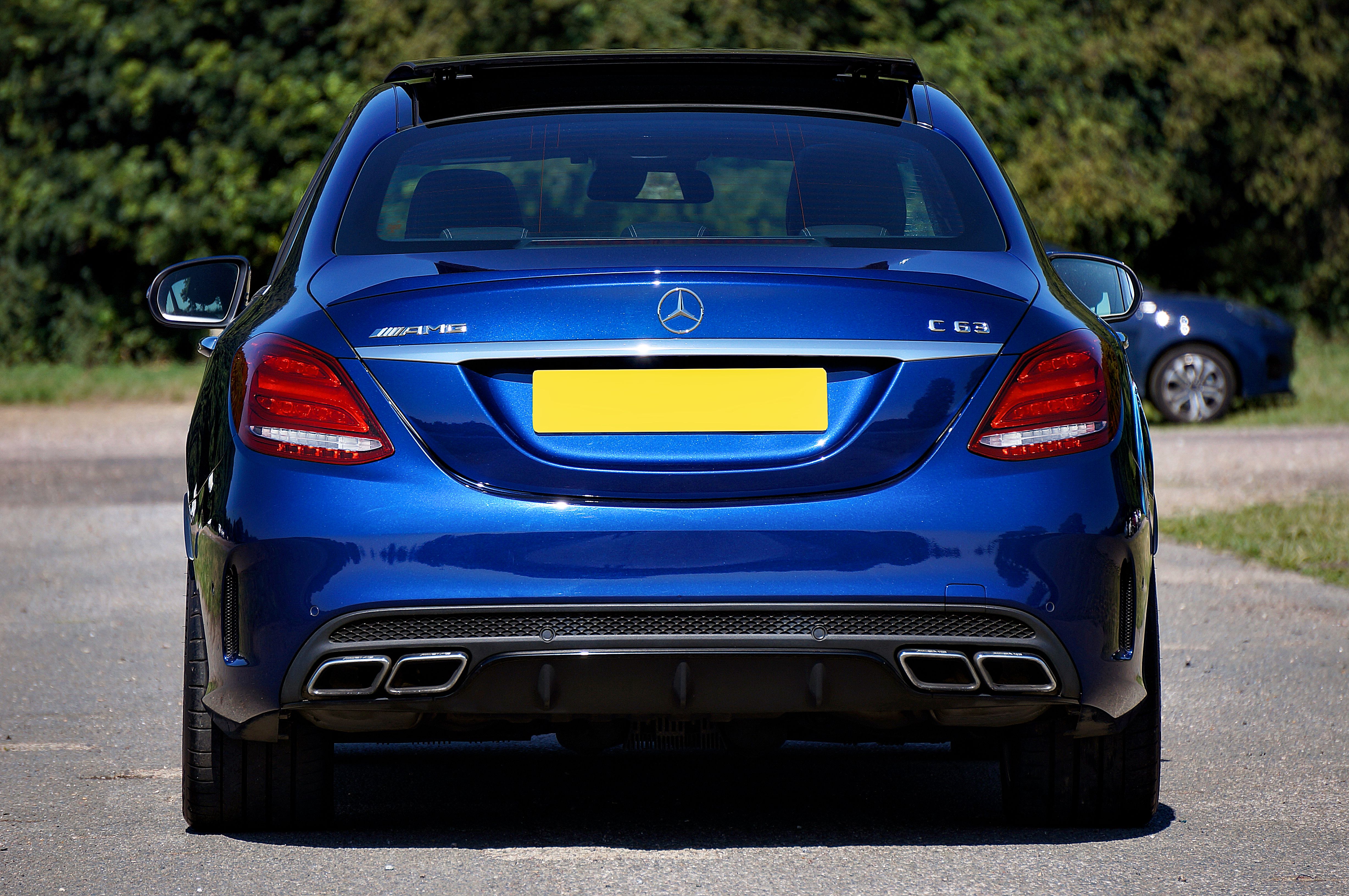 A Blue Mercedes-Benz AMG C63 on a Parking Lot · Free Stock Photo