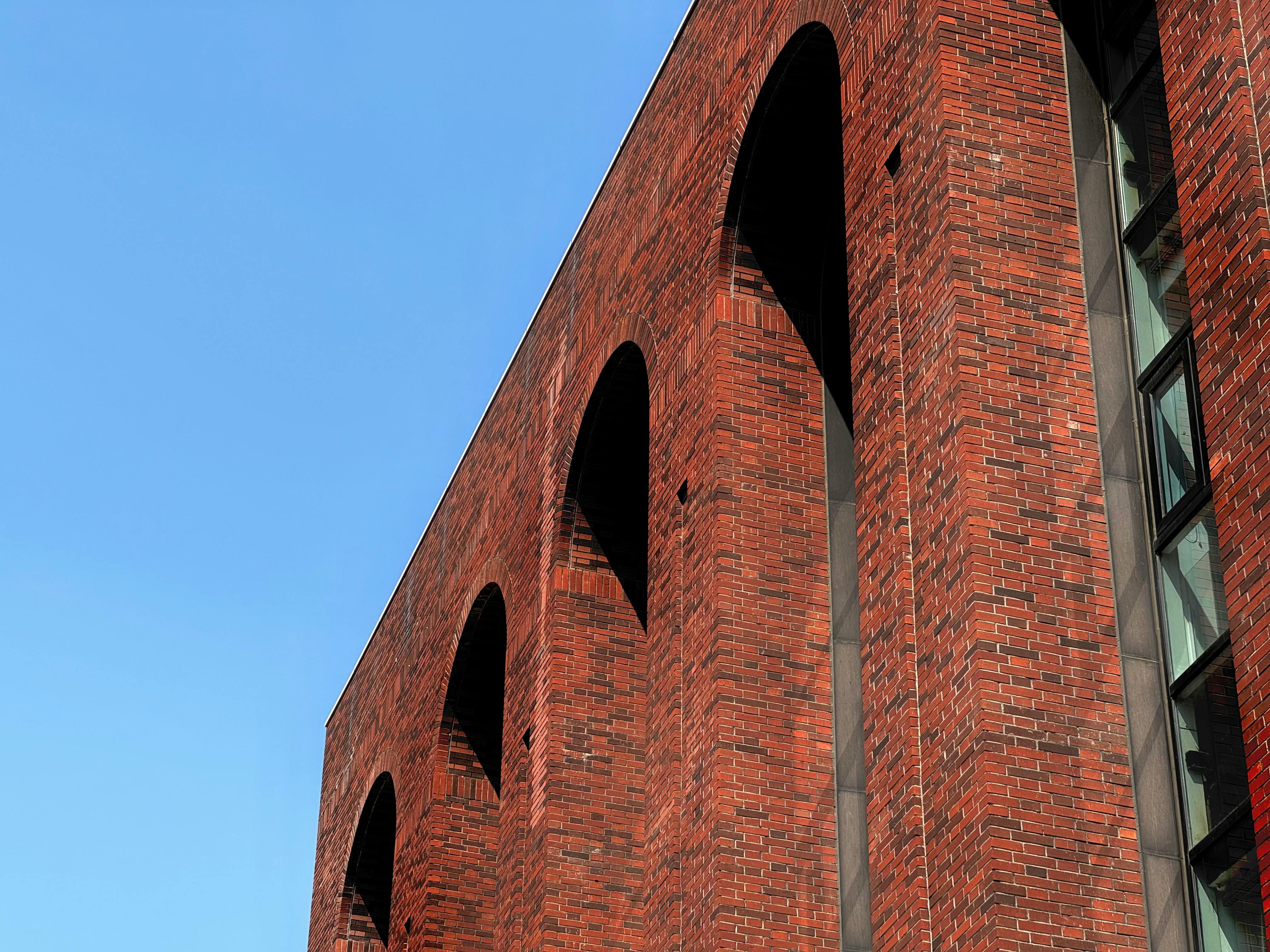 Brick Building with Arch Windows · Free Stock Photo