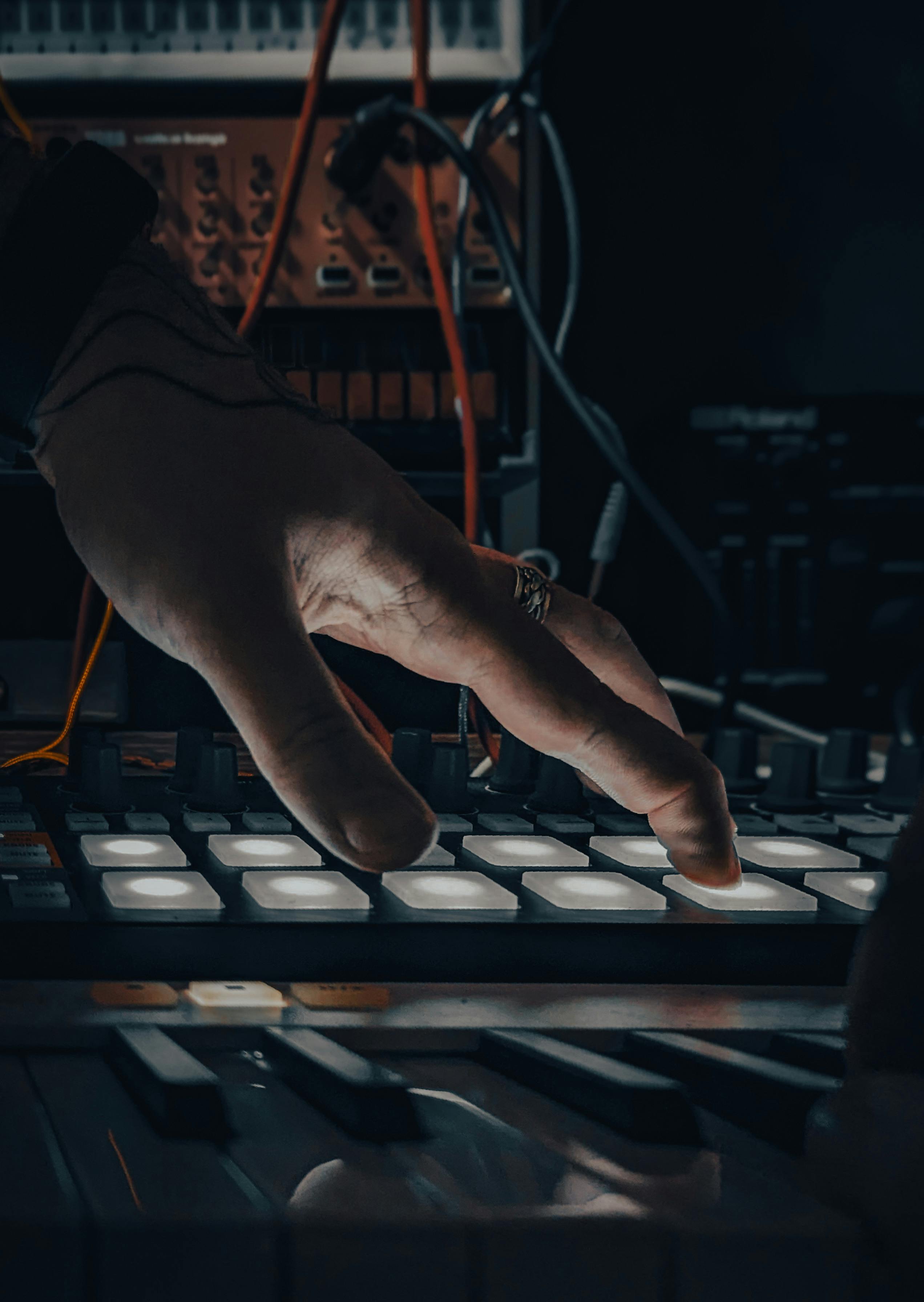 Close-Up of Hand on Music Production Controller · Free Stock Photo
