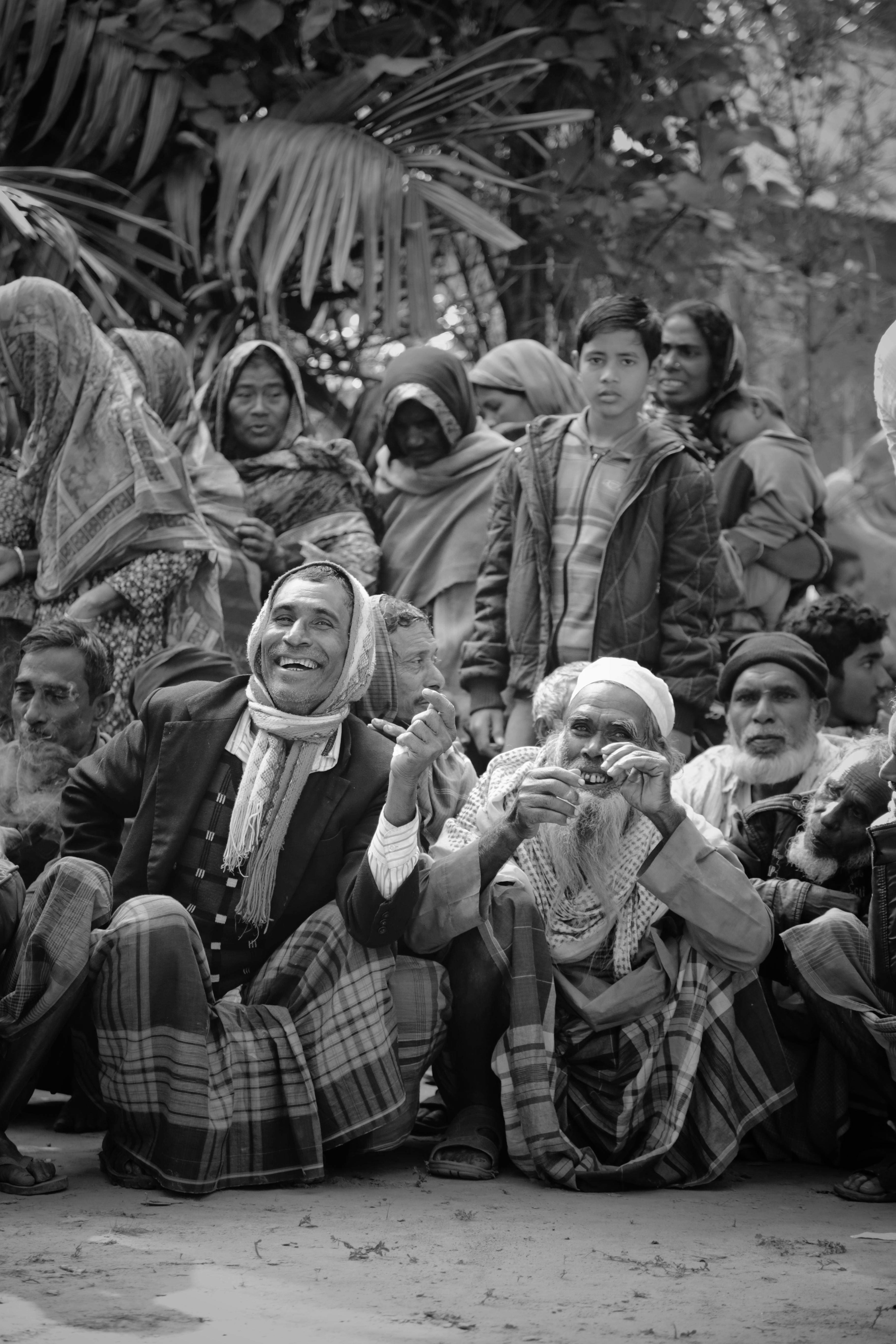 Smiled Villagers Crouching Together · Free Stock Photo