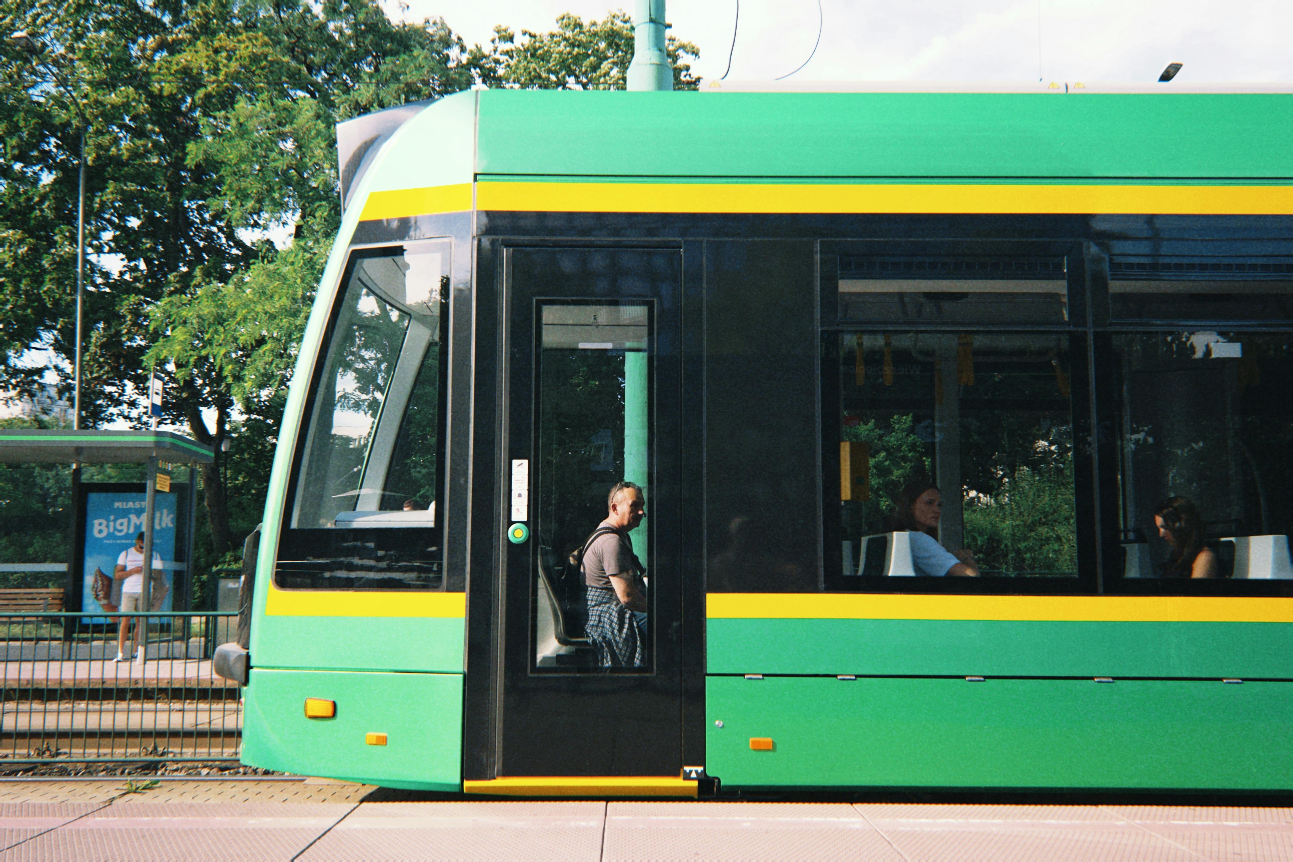 Green Tram on a Street · Free Stock Photo