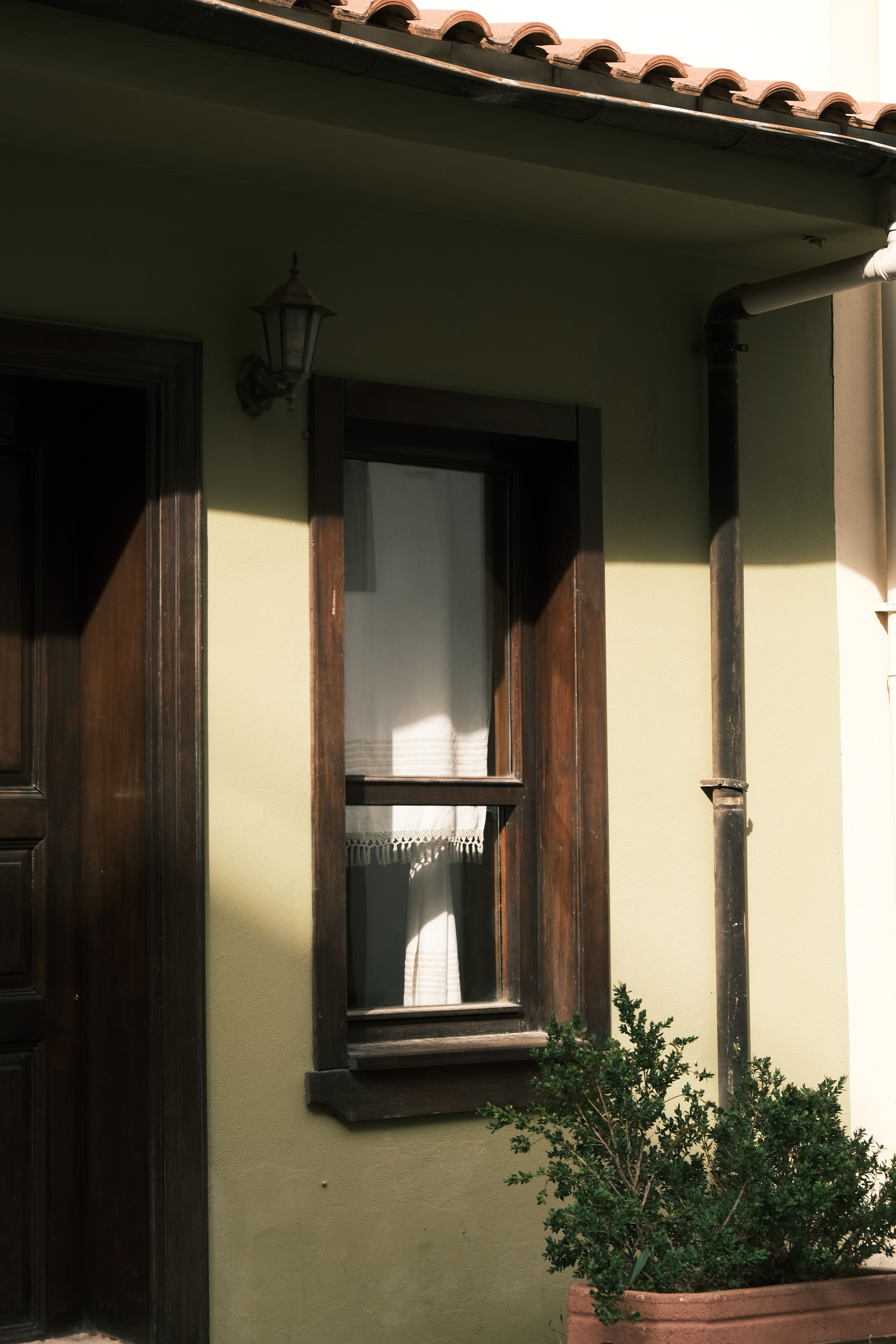 View of the Front Door and a Window in a House · Free Stock Photo