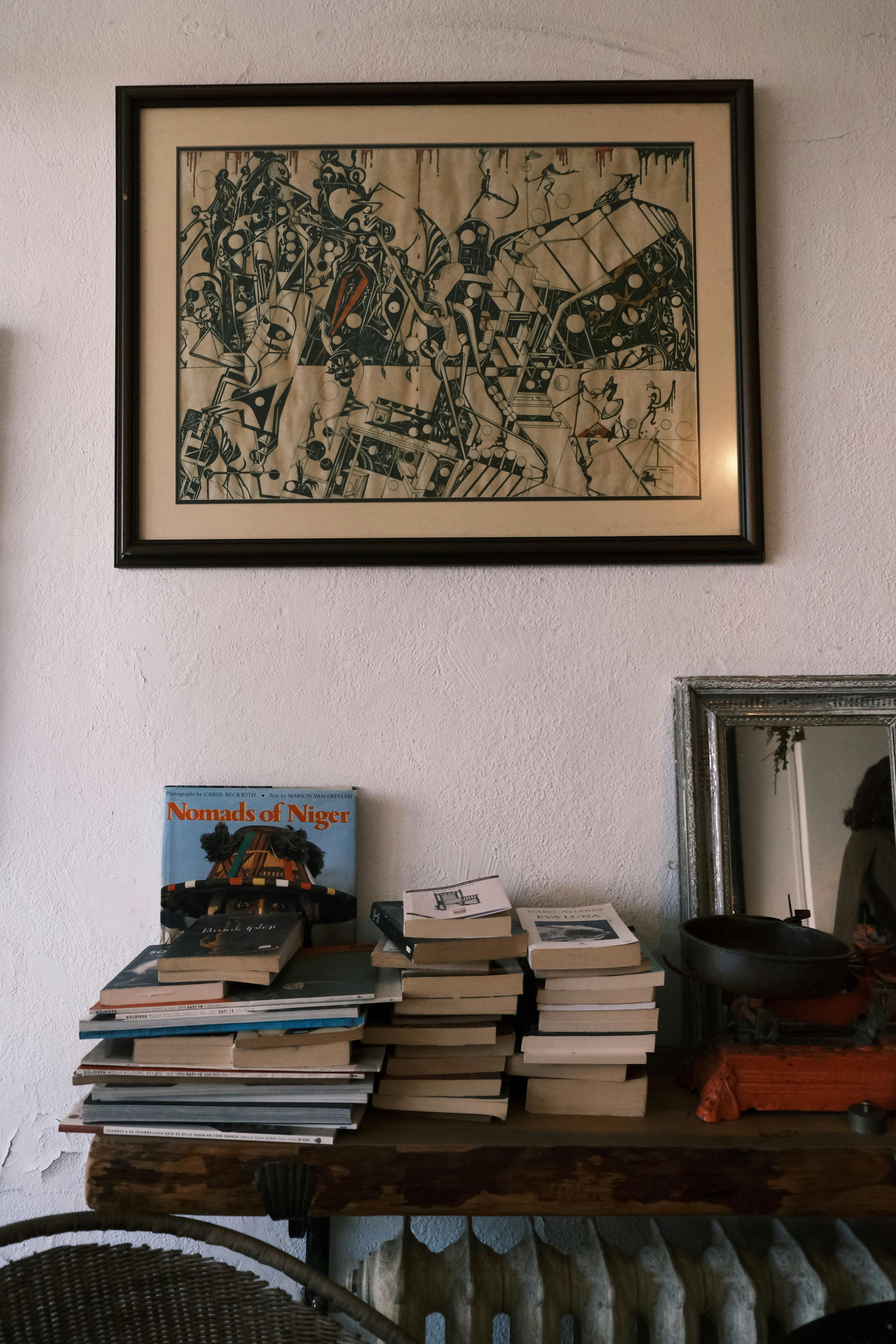 Books on Shelf under Lithography · Free Stock Photo