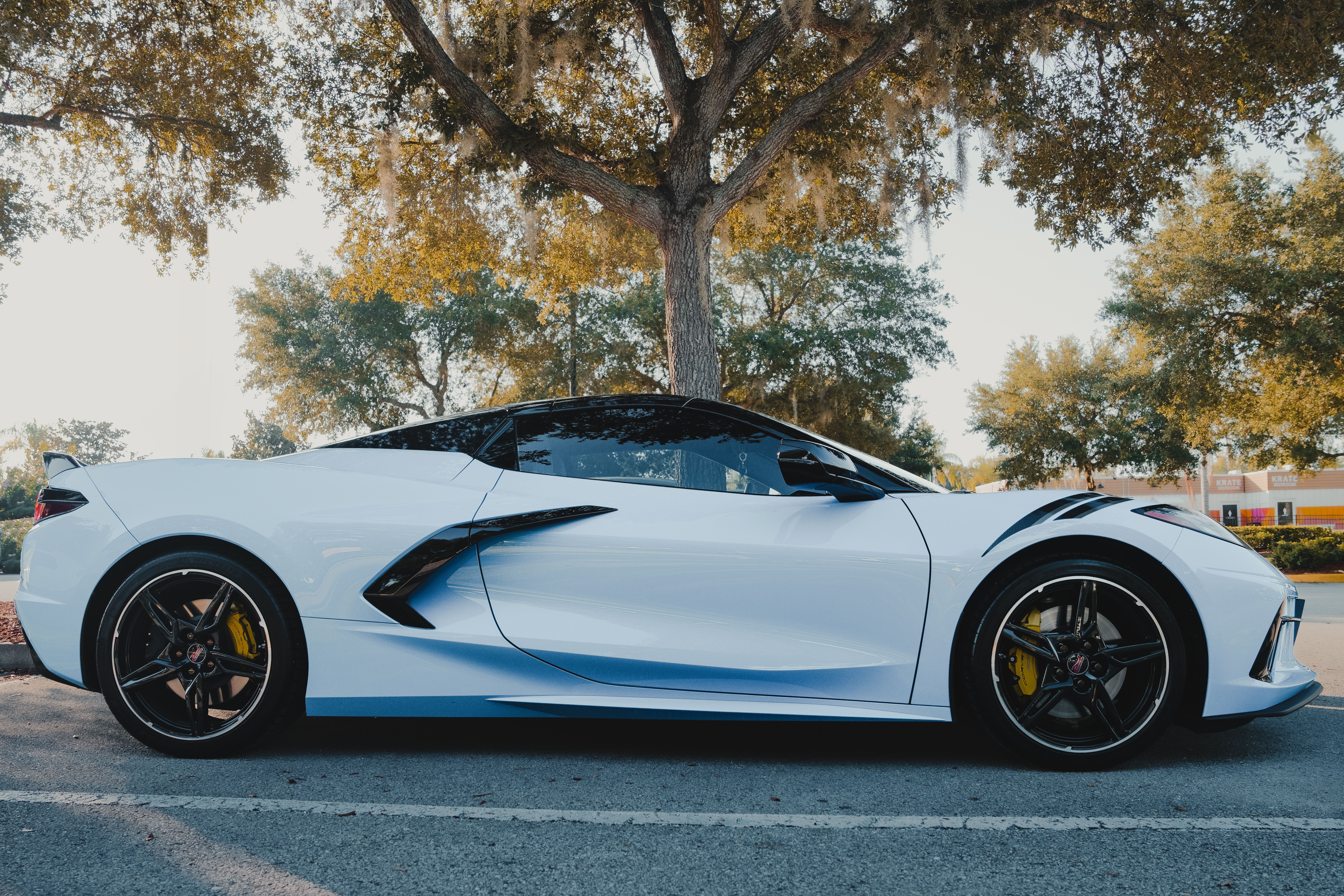 Side View of White Low Sports Car · Free Stock Photo
