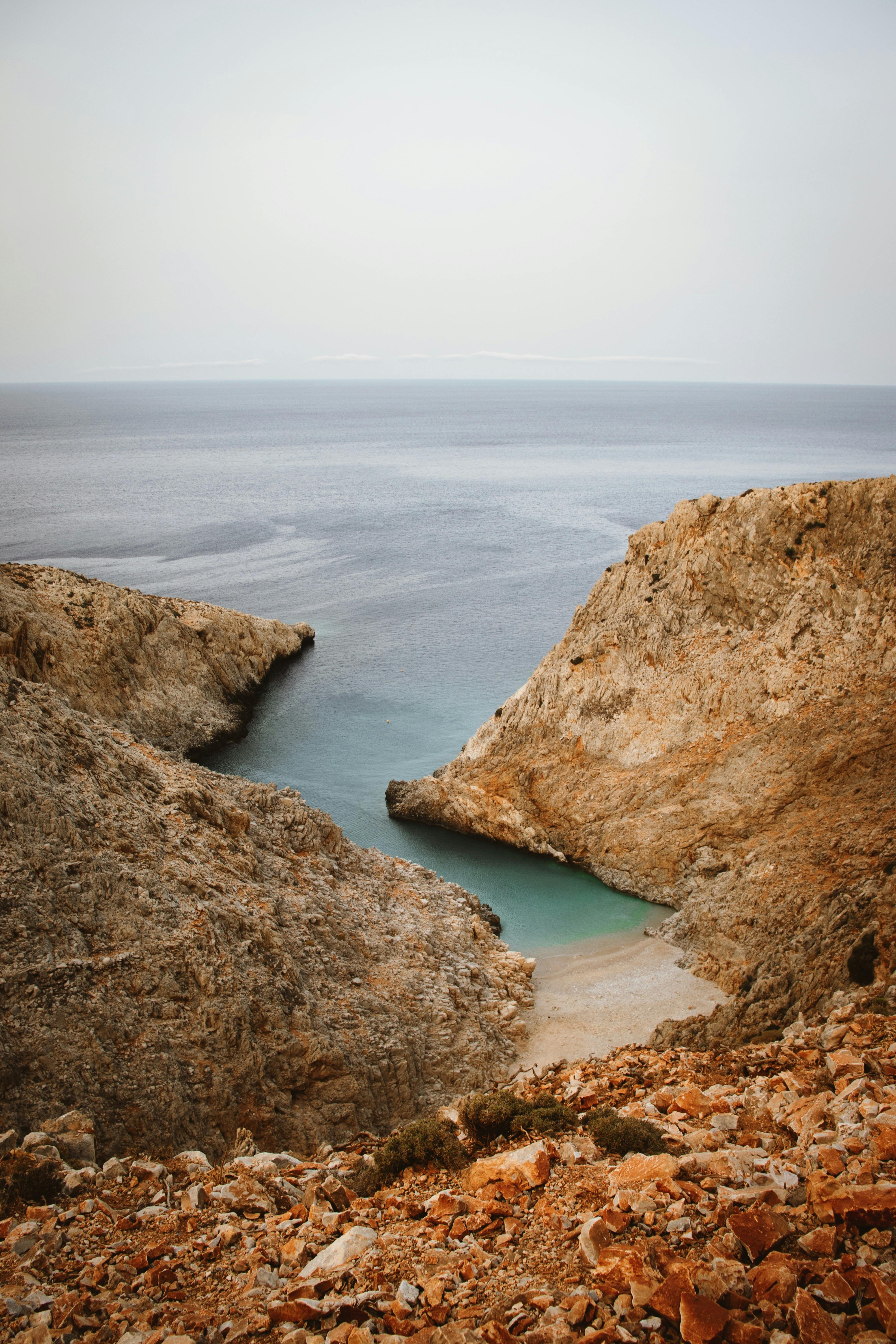 Sandstone Rocky Bay with Narrow Beach · Free Stock Photo