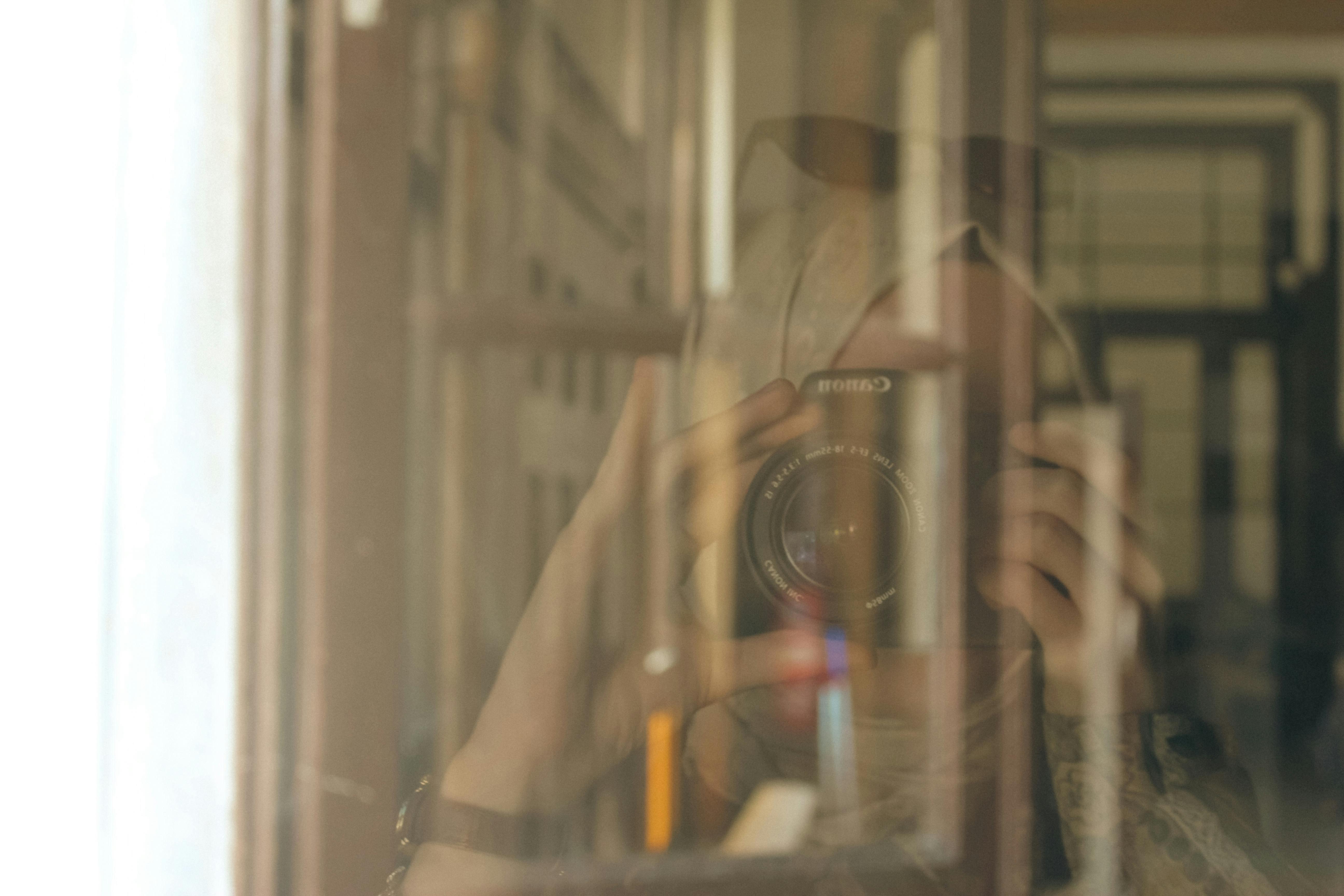 Reflective Self-Portrait Through Glass · Free Stock Photo