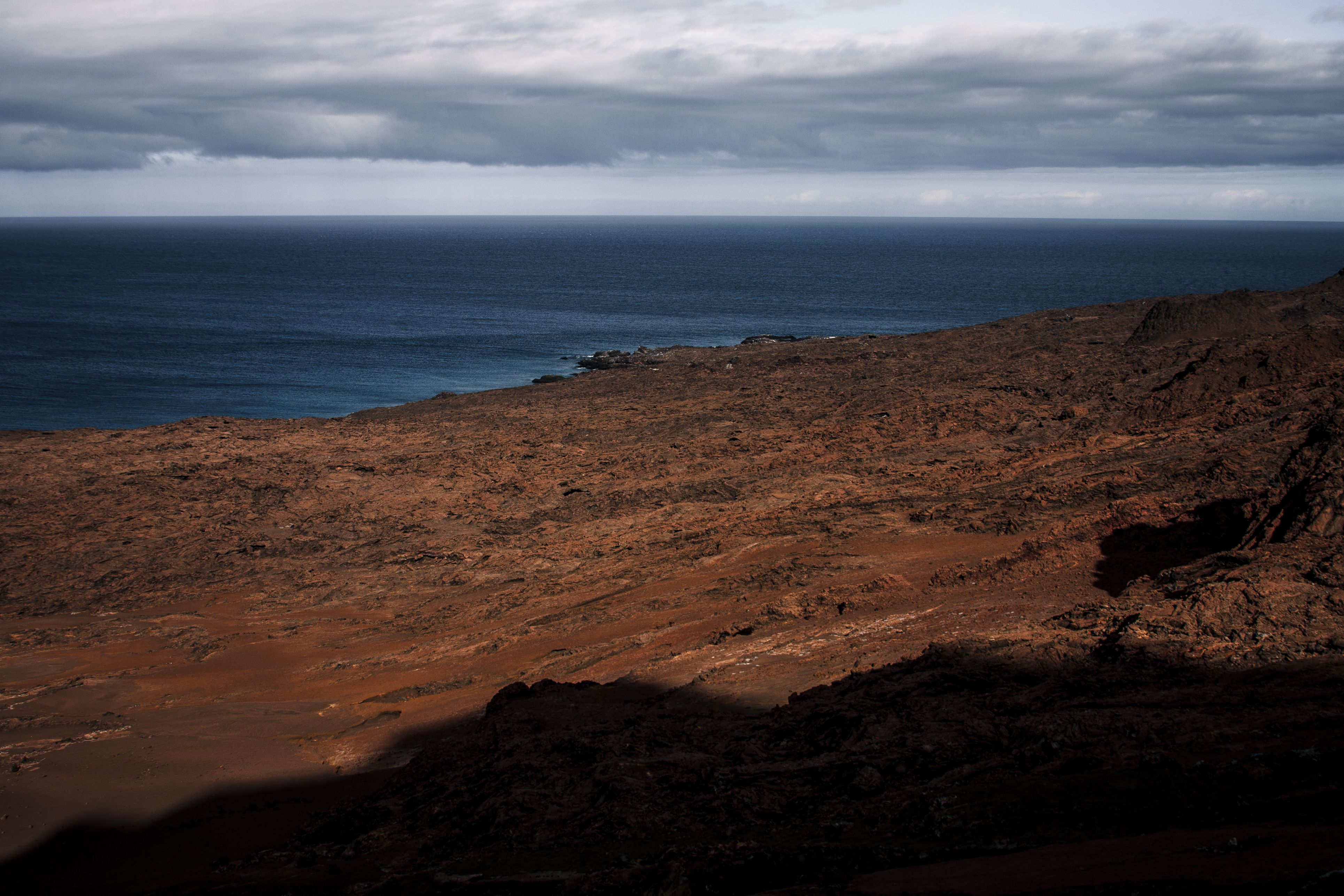 Brown Terrain Near Body of Water · Free Stock Photo
