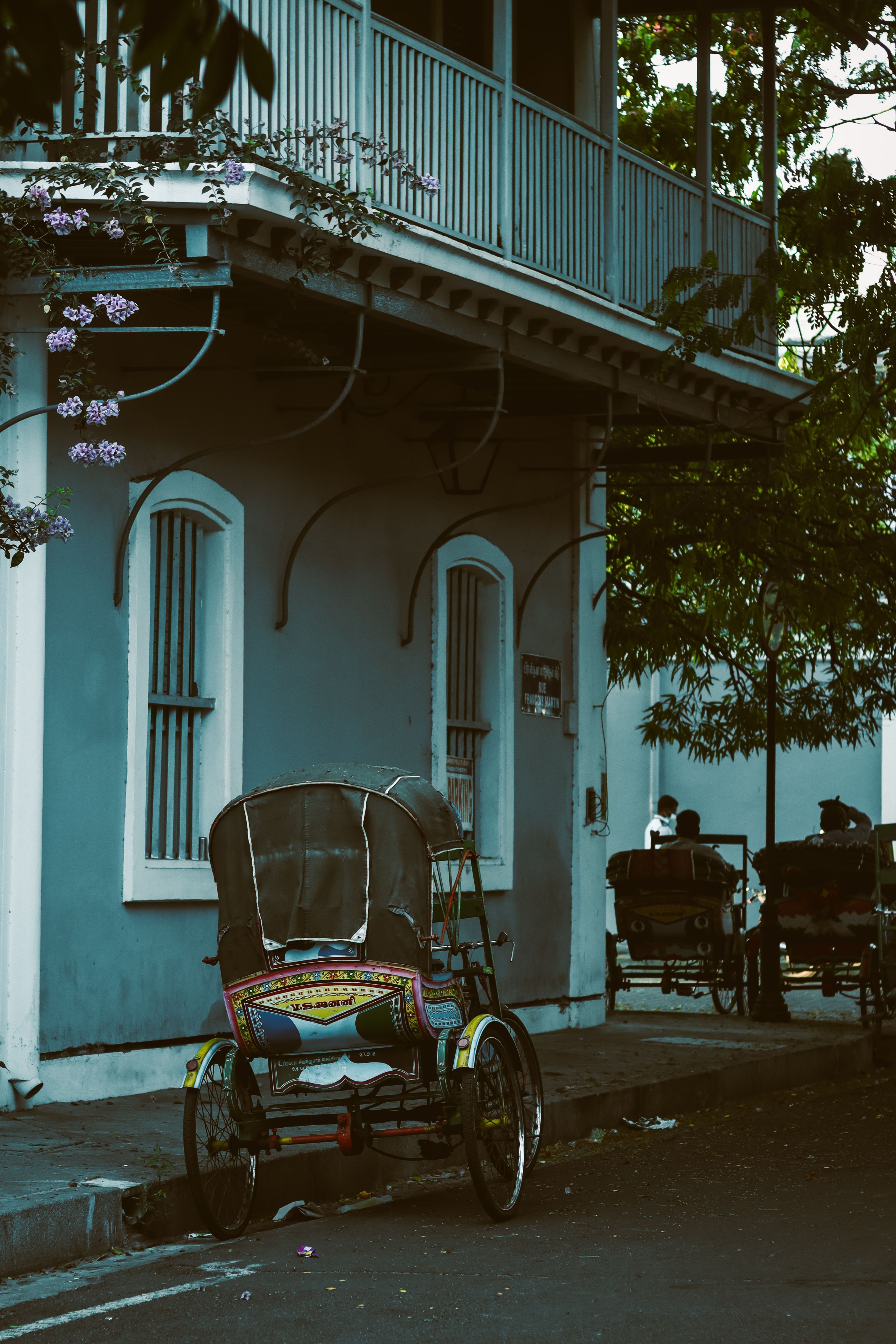 A Rickshaw Standing Outside of a Building · Free Stock Photo