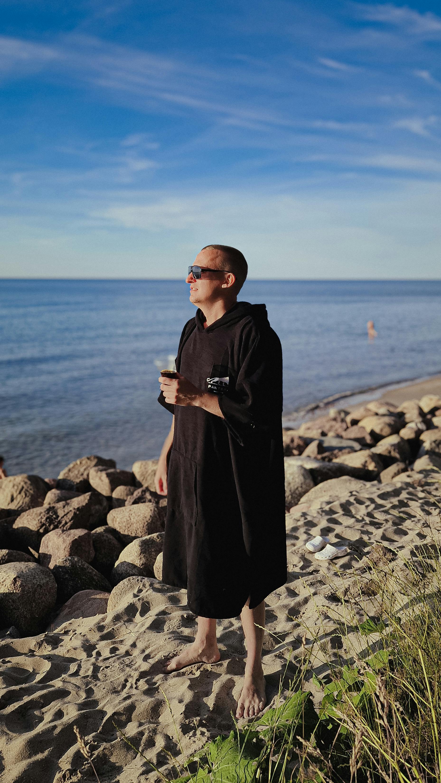 Man in Robes Standing on Beach · Free Stock Photo