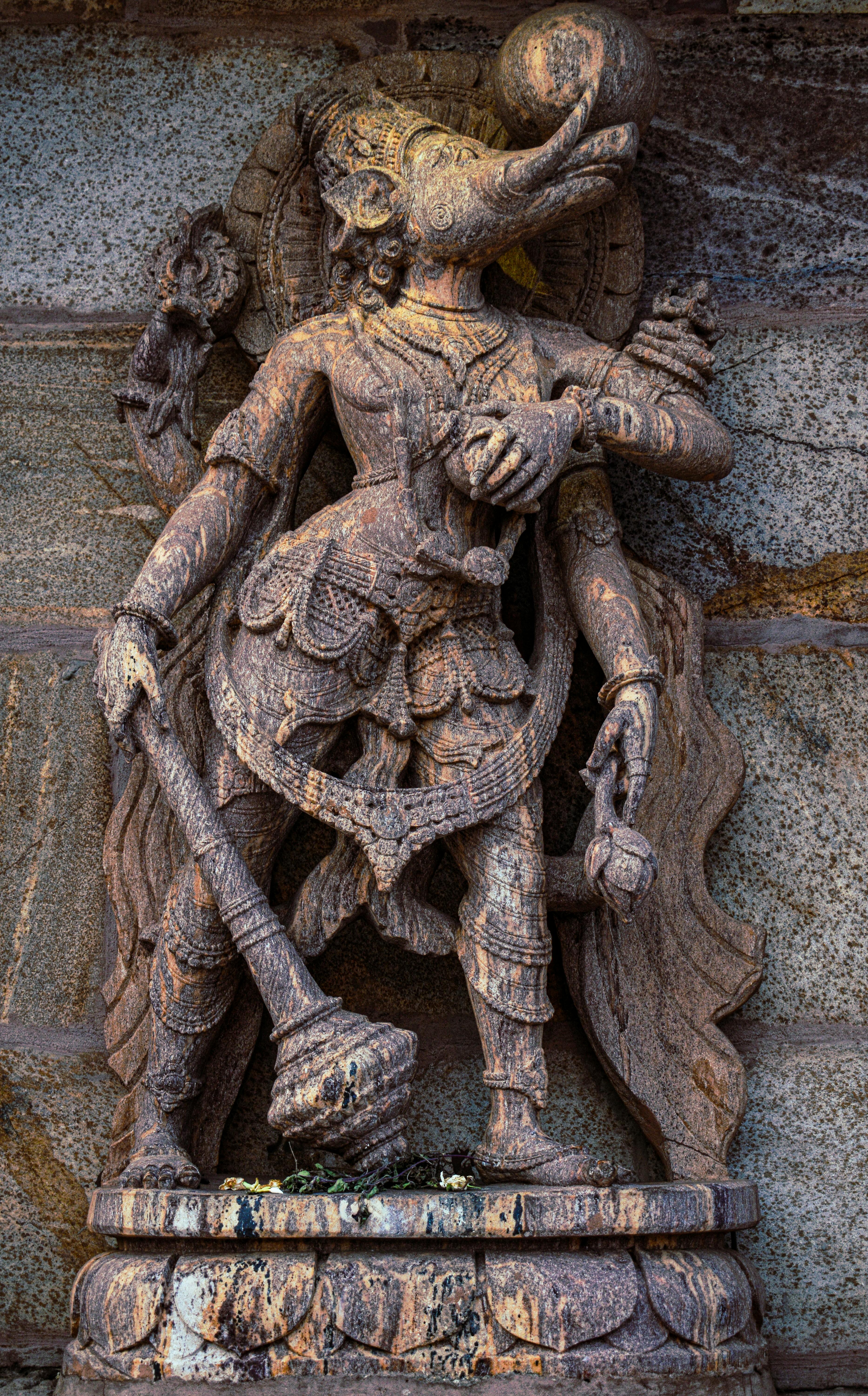 Close-up of a Carved Statue on a Temple Exterior · Free Stock Photo