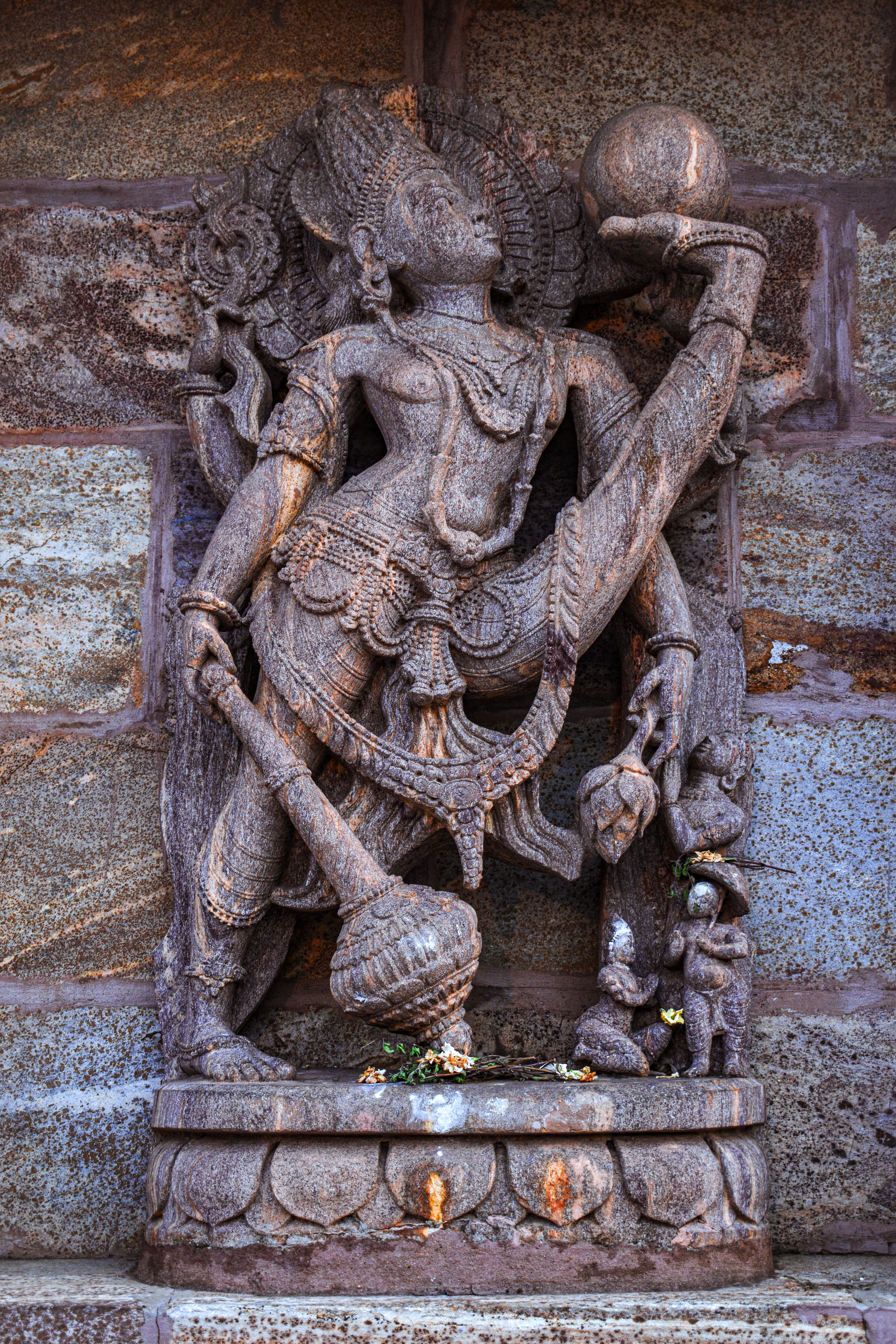 Close-up of a Carved Statue on a Temple Exterior · Free Stock Photo