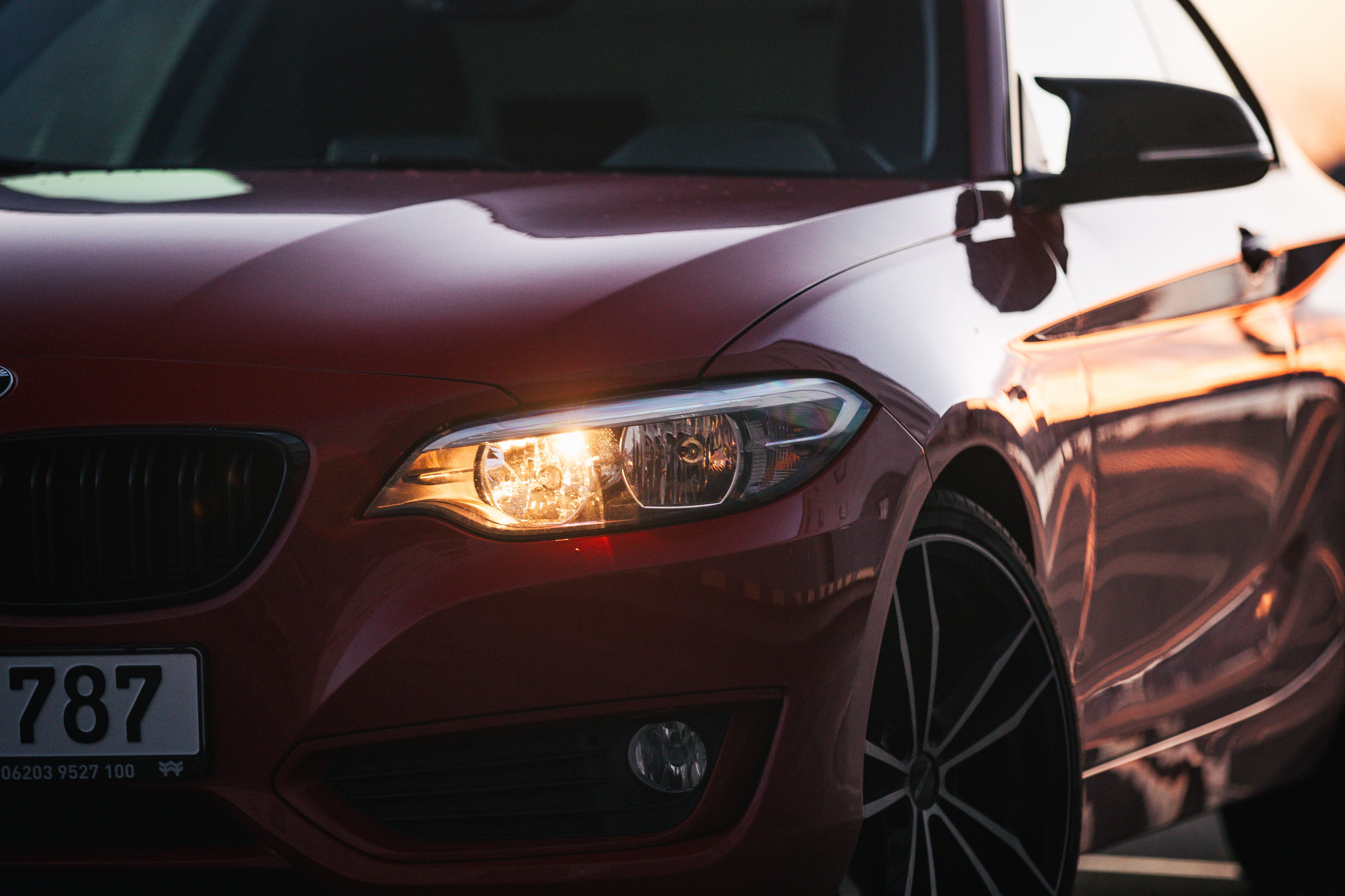 The front end of a red bmw car · Free Stock Photo