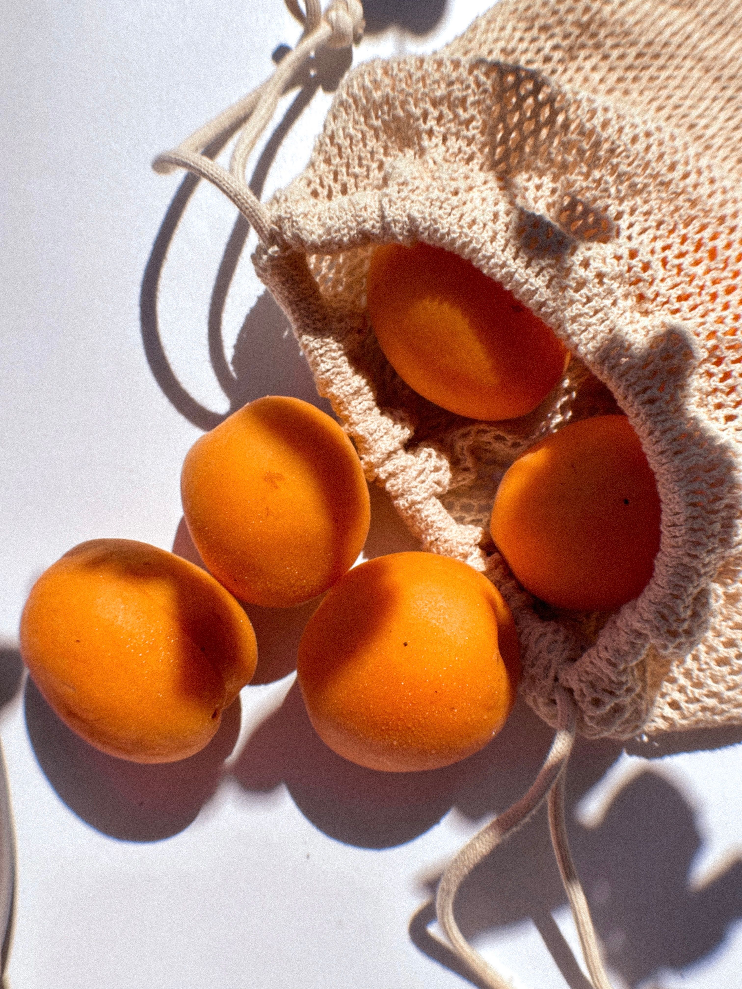 Close-up of a Bag of Apricots · Free Stock Photo