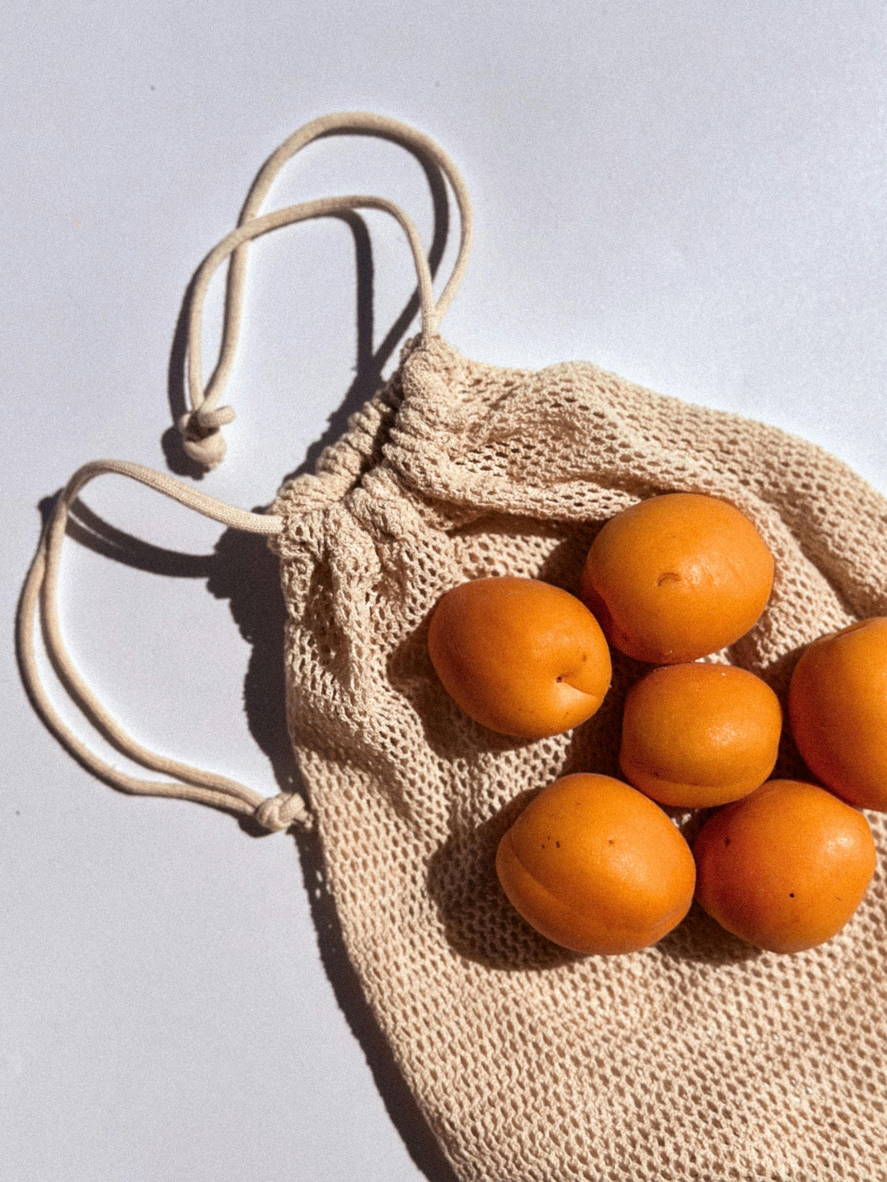 Apricots Lying on Top of String Bag · Free Stock Photo