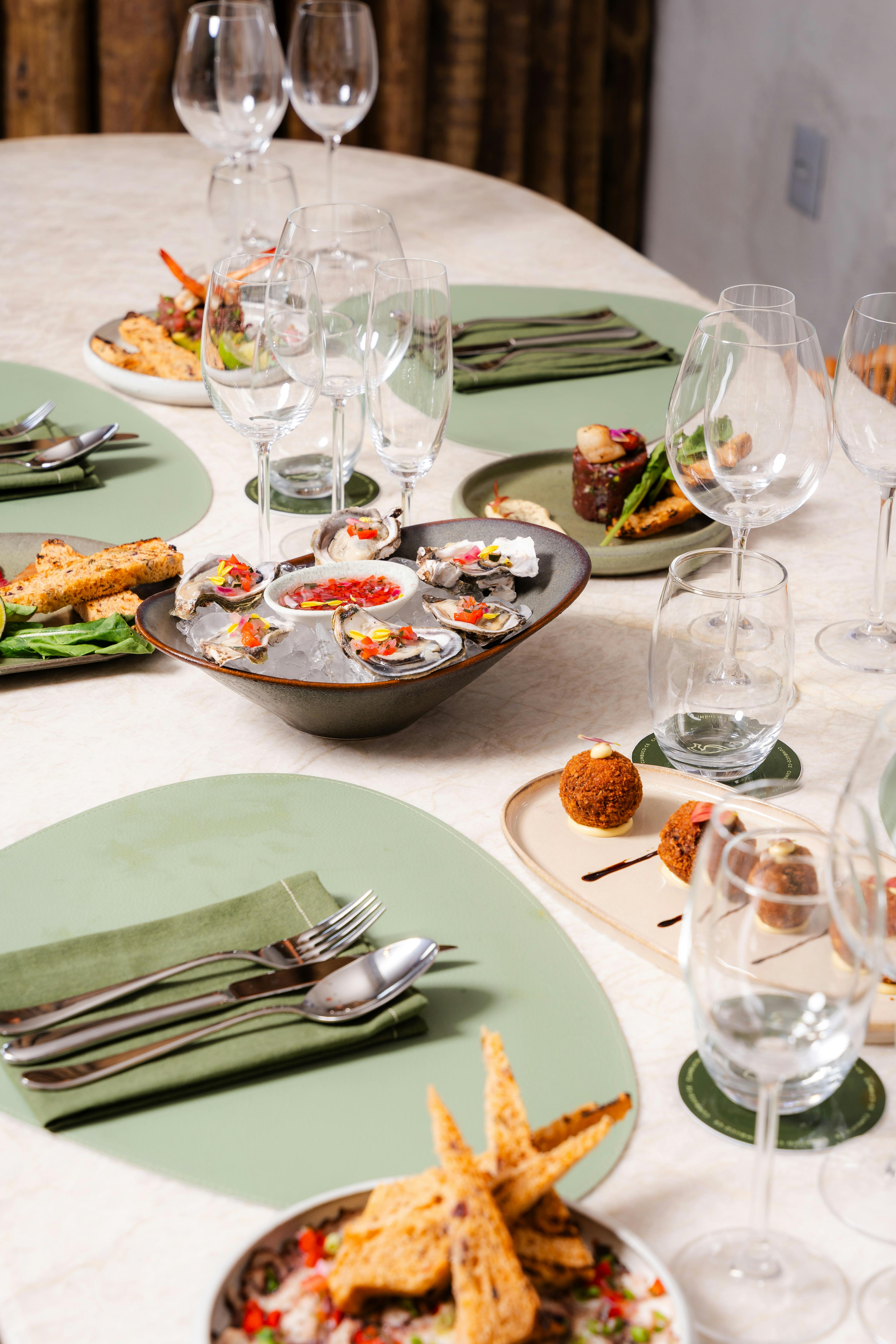 Photo of a Set Table with Gourmet Dishes · Free Stock Photo
