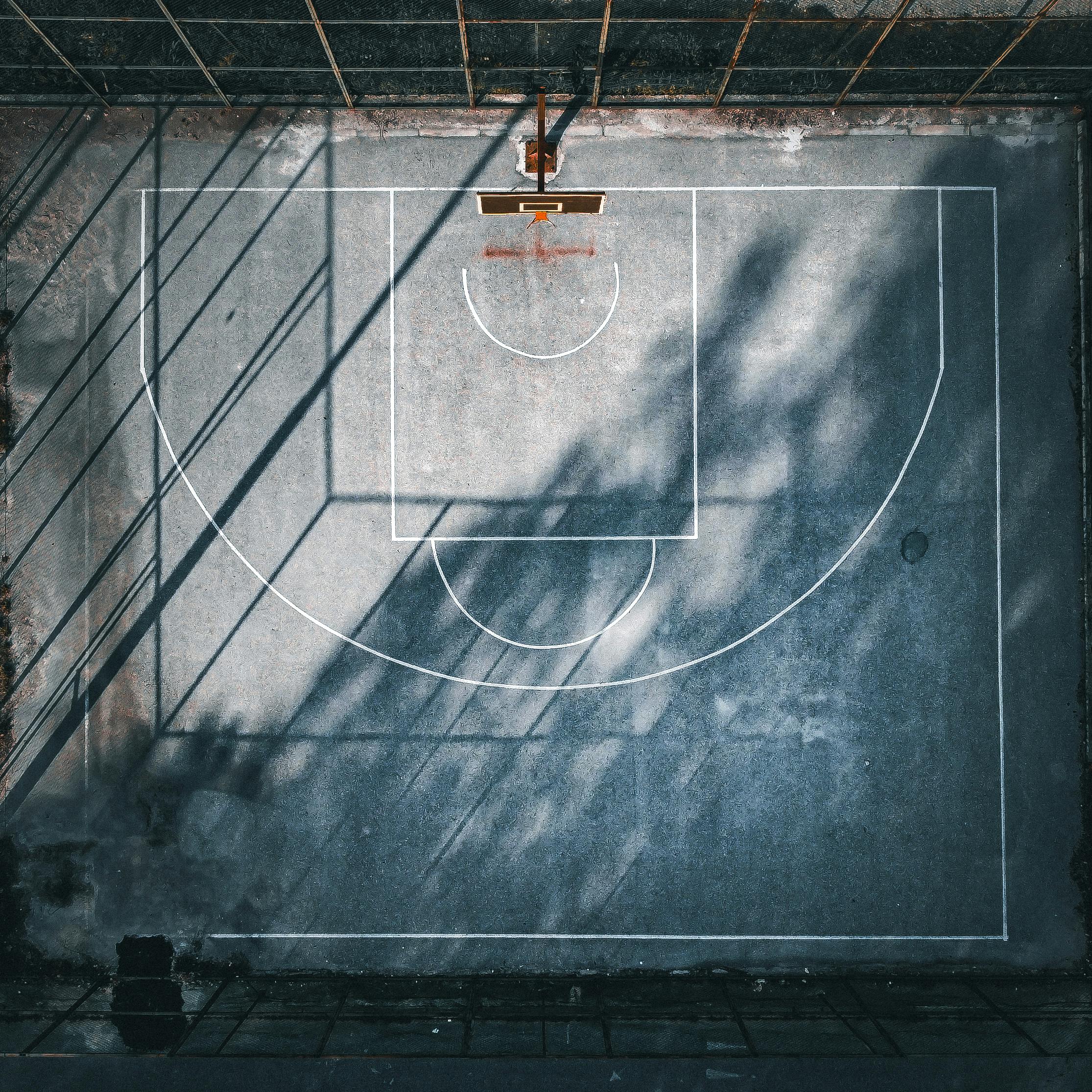Shadow of basketball hoop on wall · Free Stock Photo