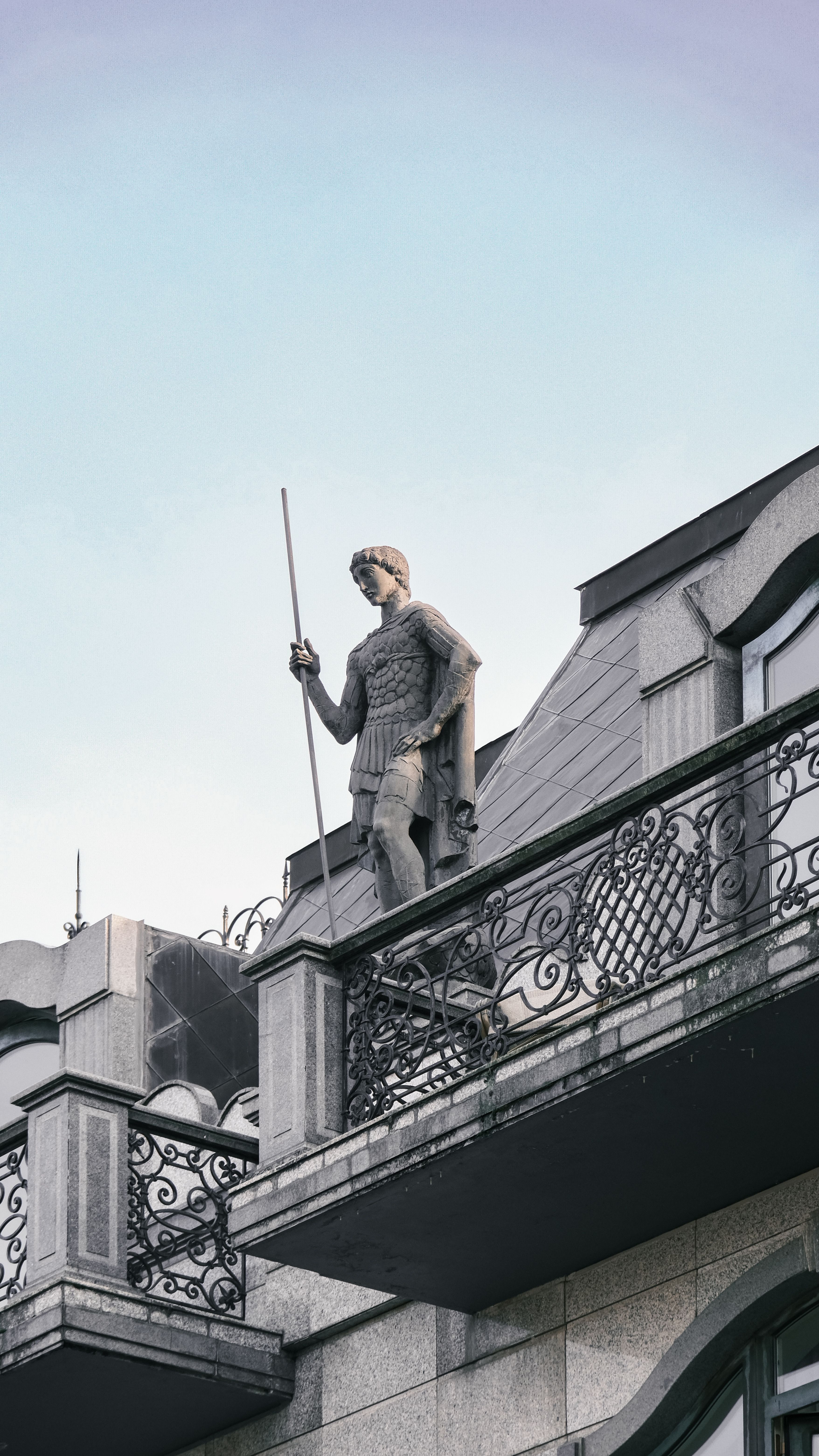 Classical Style Sculpture of Man on Balcony of Old Tenement · Free ...