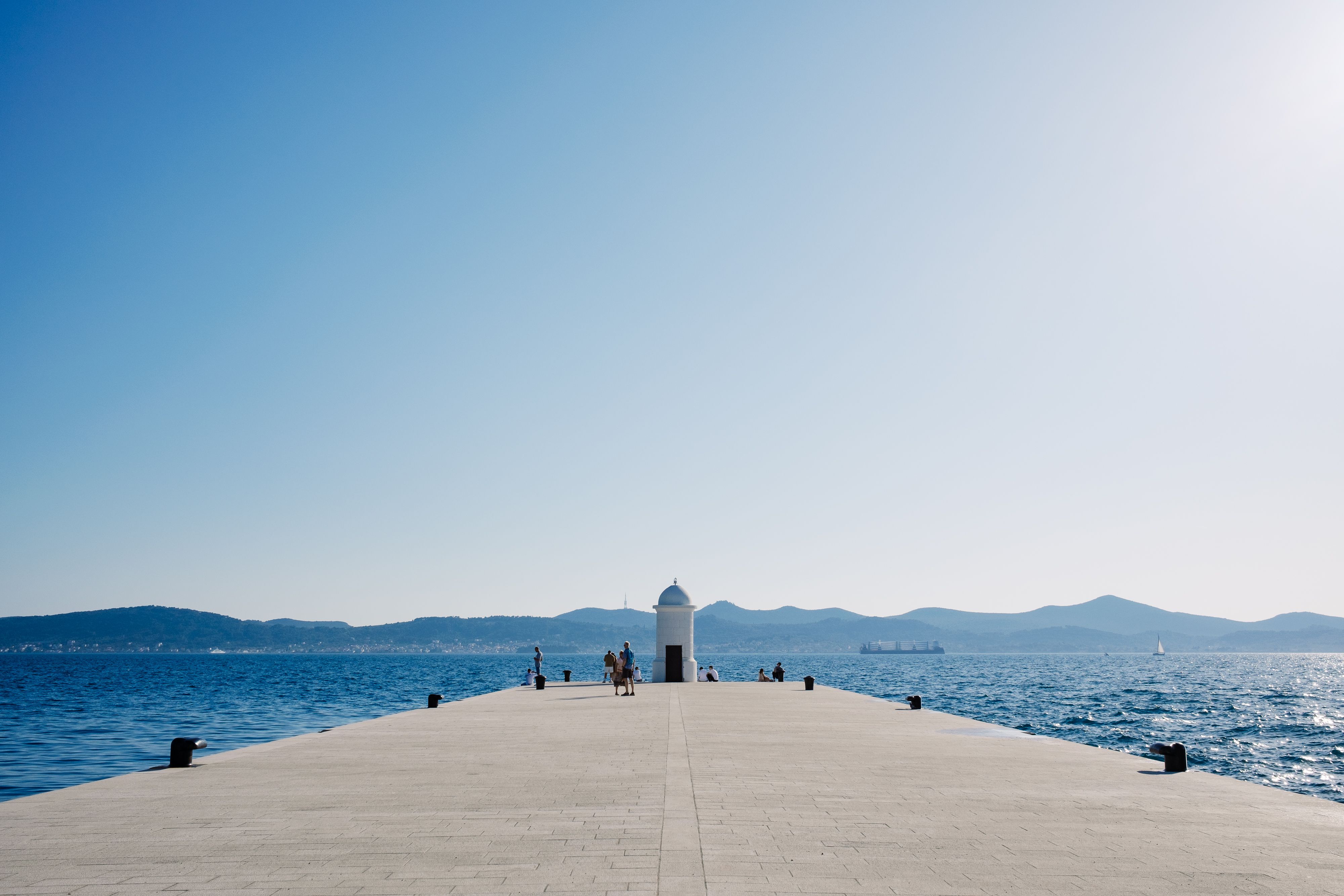 Lighthouse at the End of Pier · Free Stock Photo