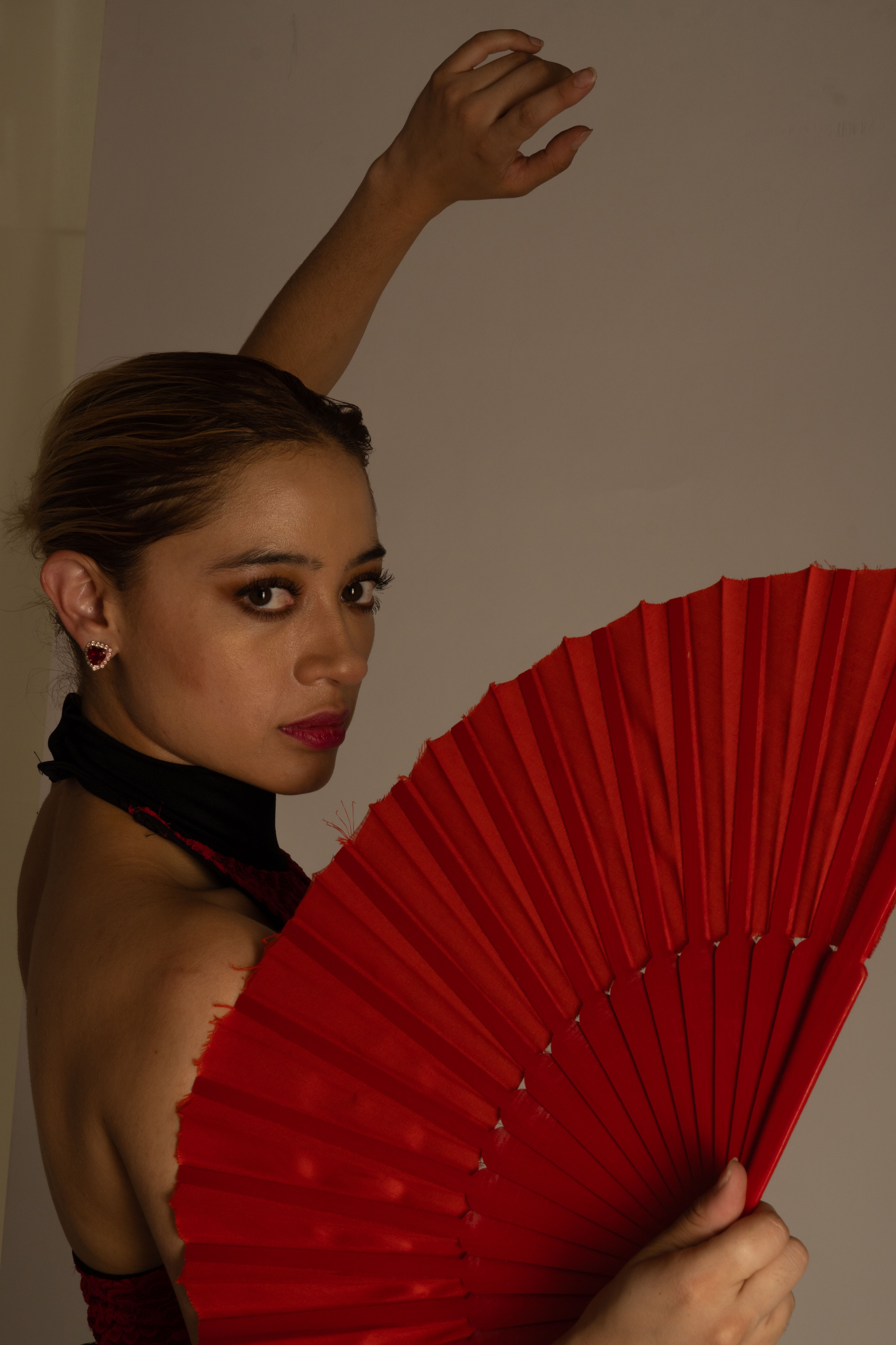 Portrait of Brunette Woman with Fan · Free Stock Photo