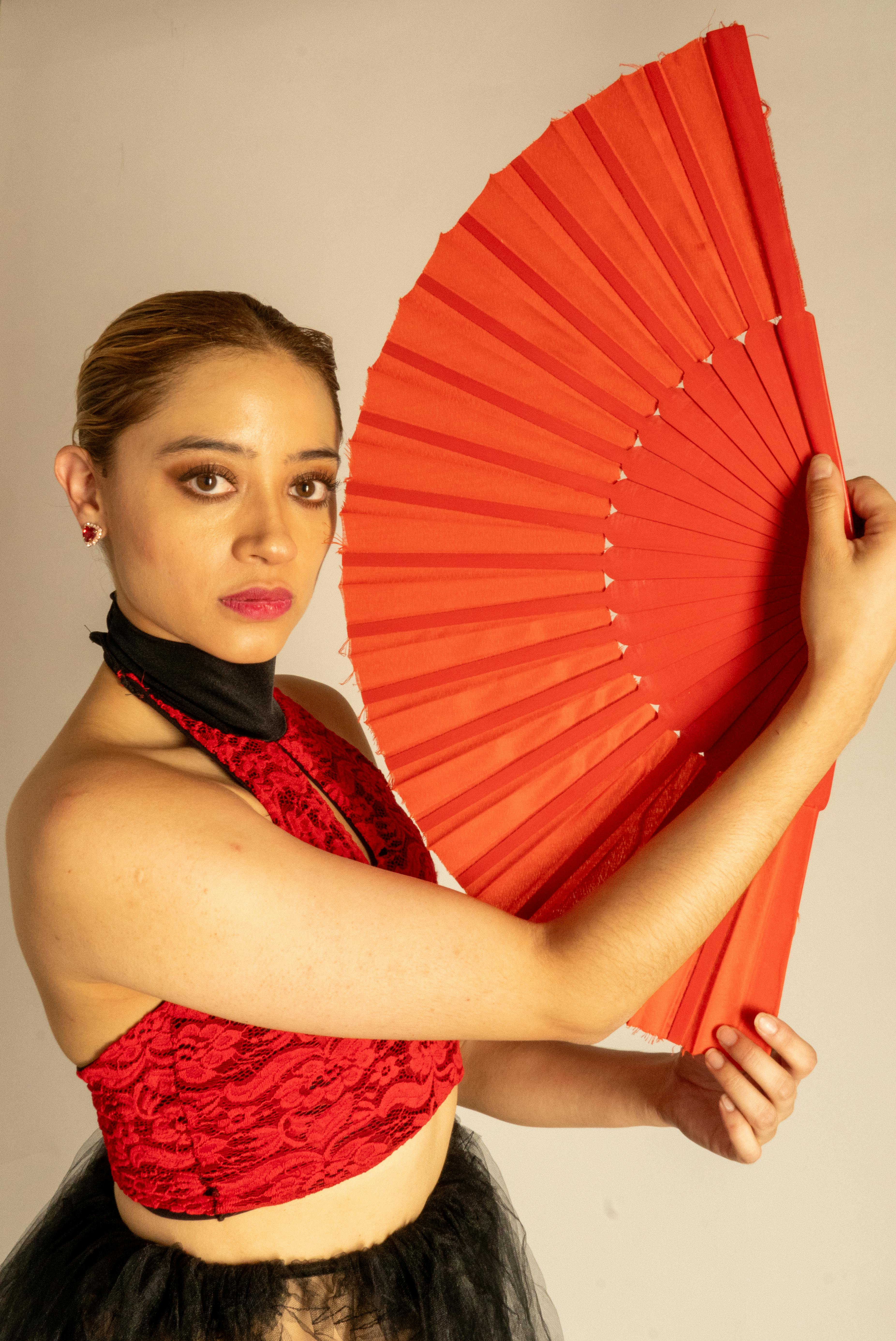 Woman Holding Red Fan · Free Stock Photo