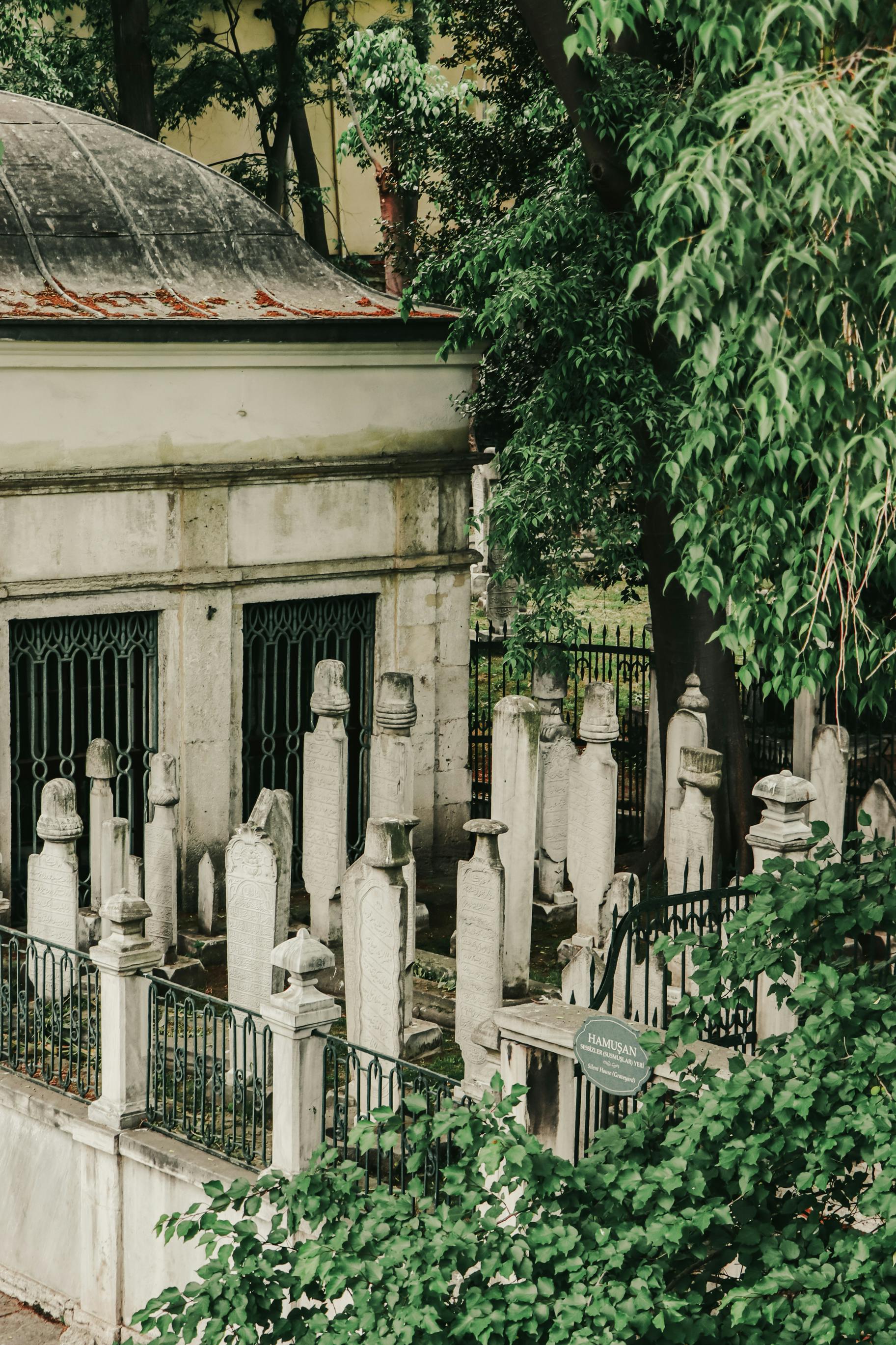 A cemetery with a large stone building in the middle · Free Stock Photo