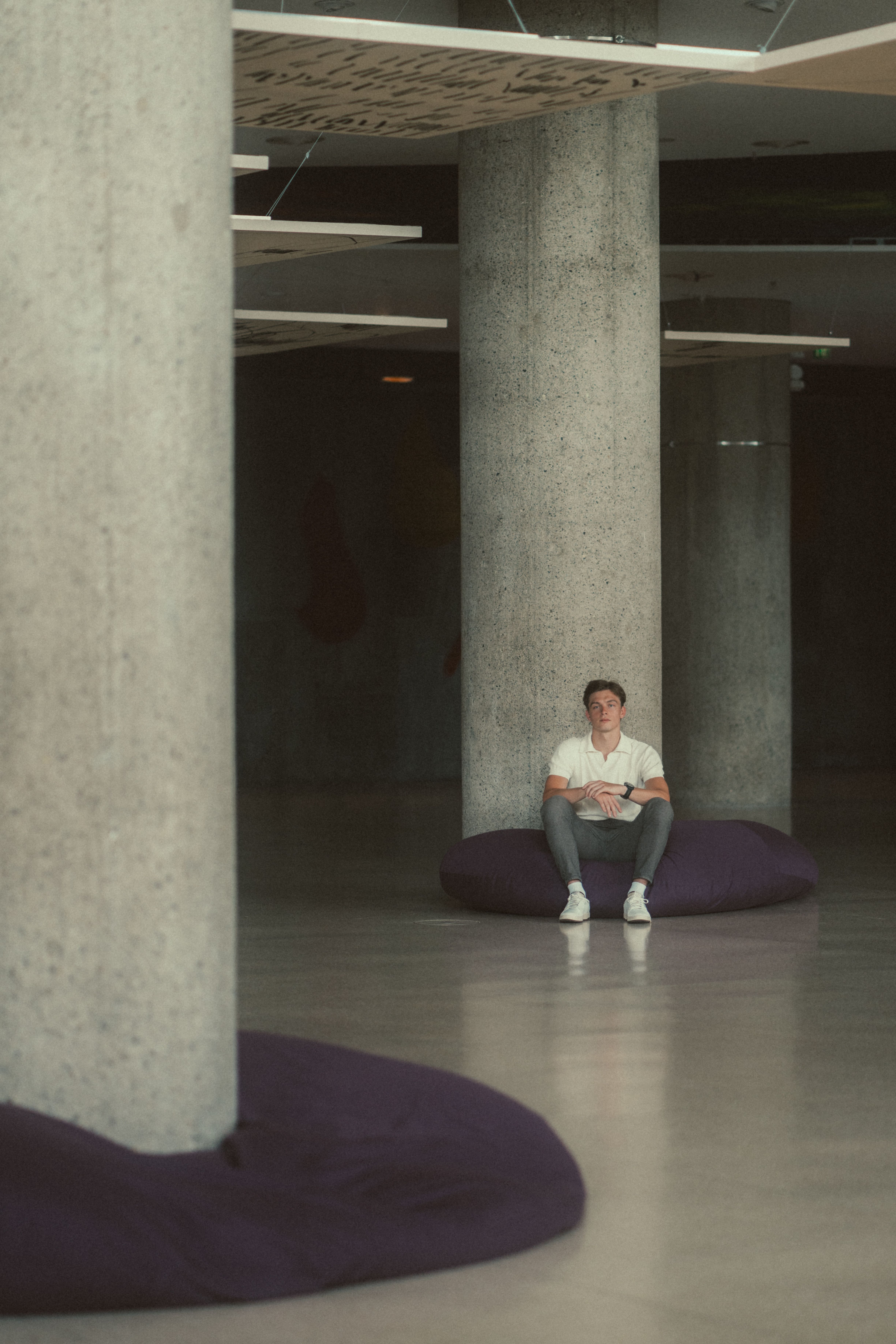 Man Sitting Among Columns · Free Stock Photo