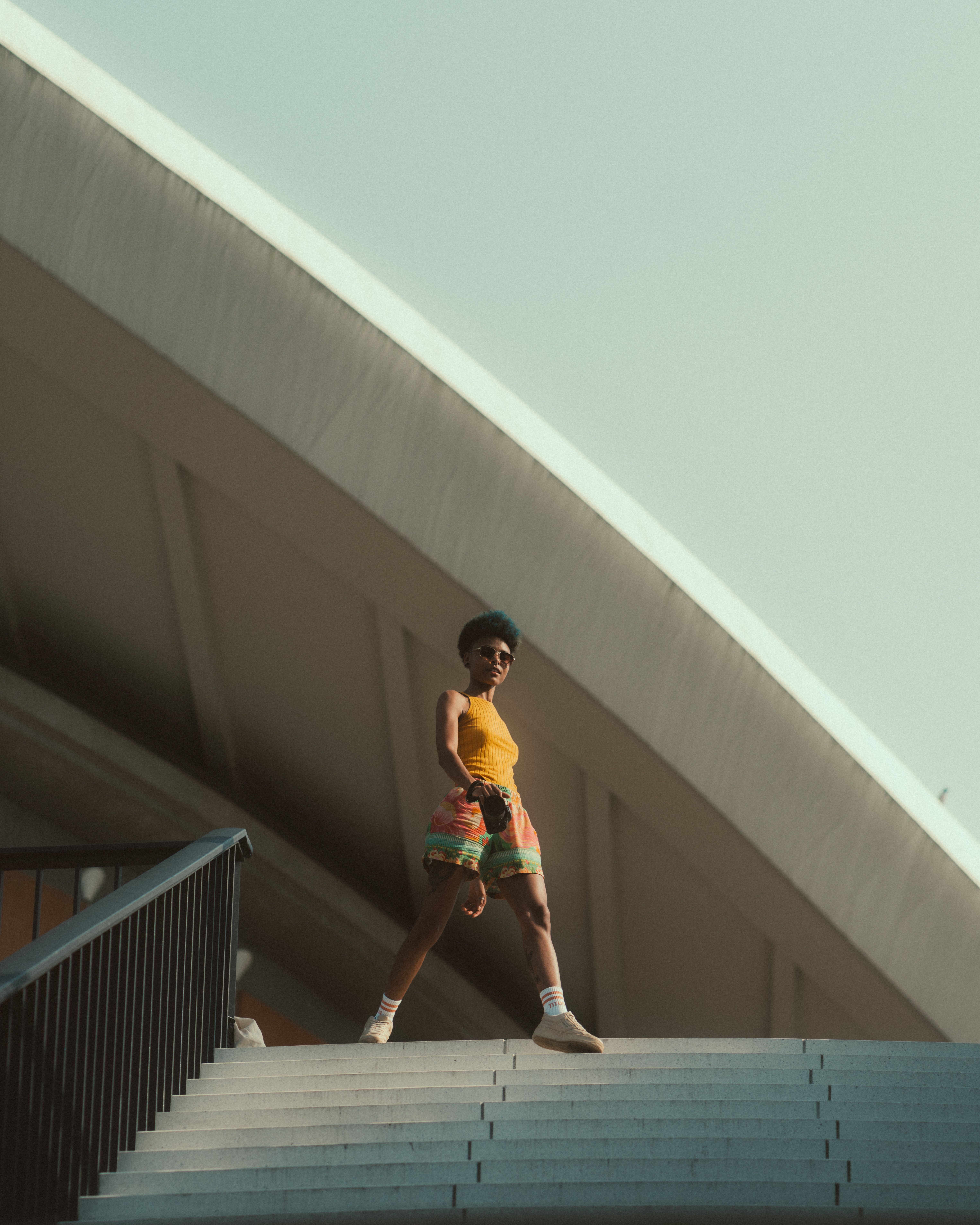 Young Woman in Summer Floral Clothing Going Down Concrete Outdoors ...