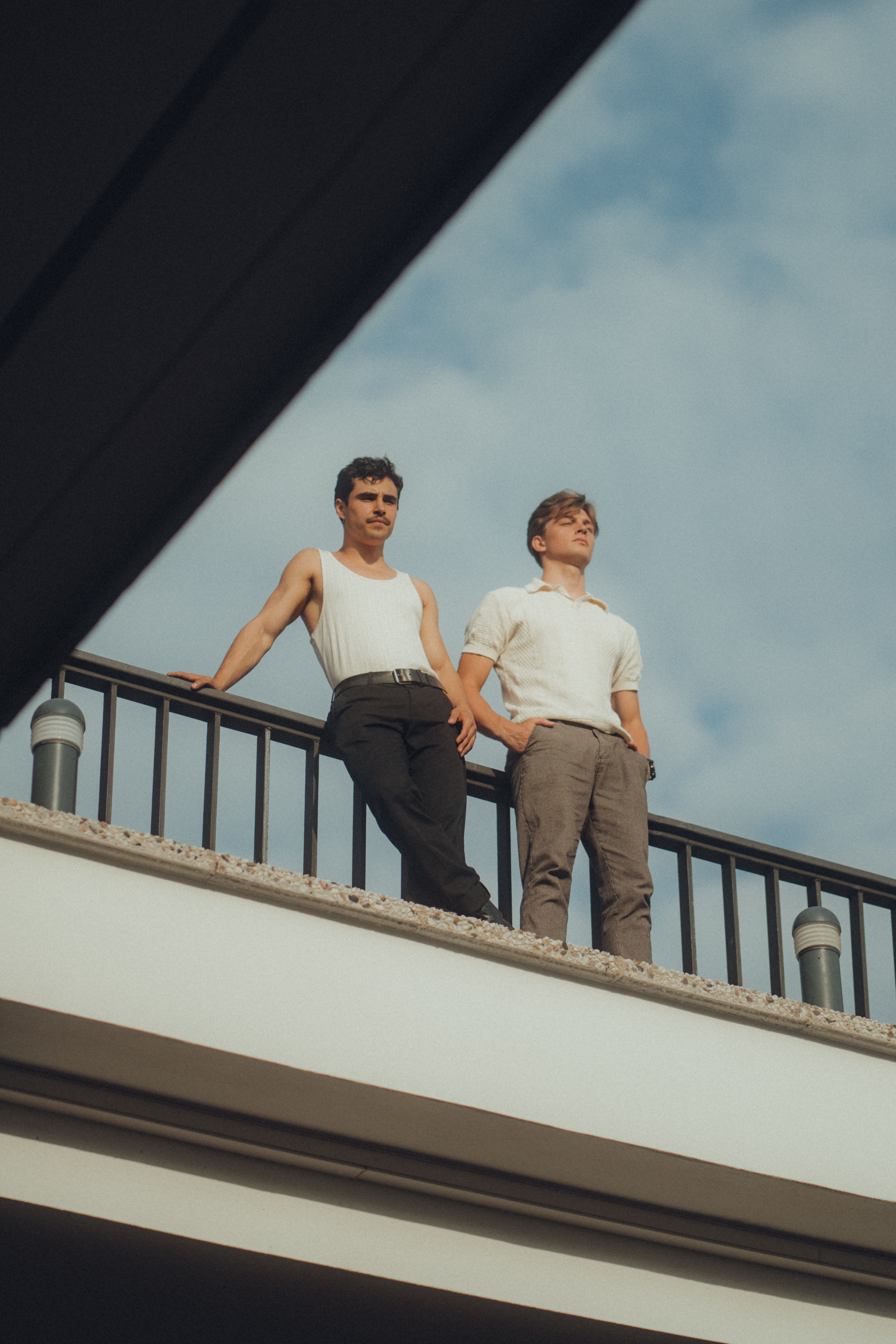 Men Standing on a Bridge · Free Stock Photo