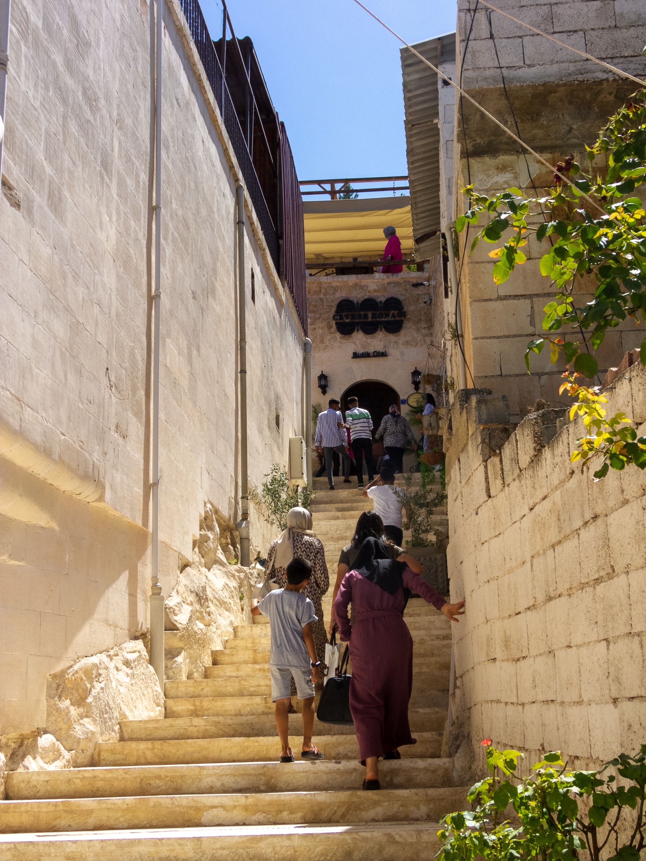 People Walking on Stairs in Narrow Alley in Town · Free Stock Photo