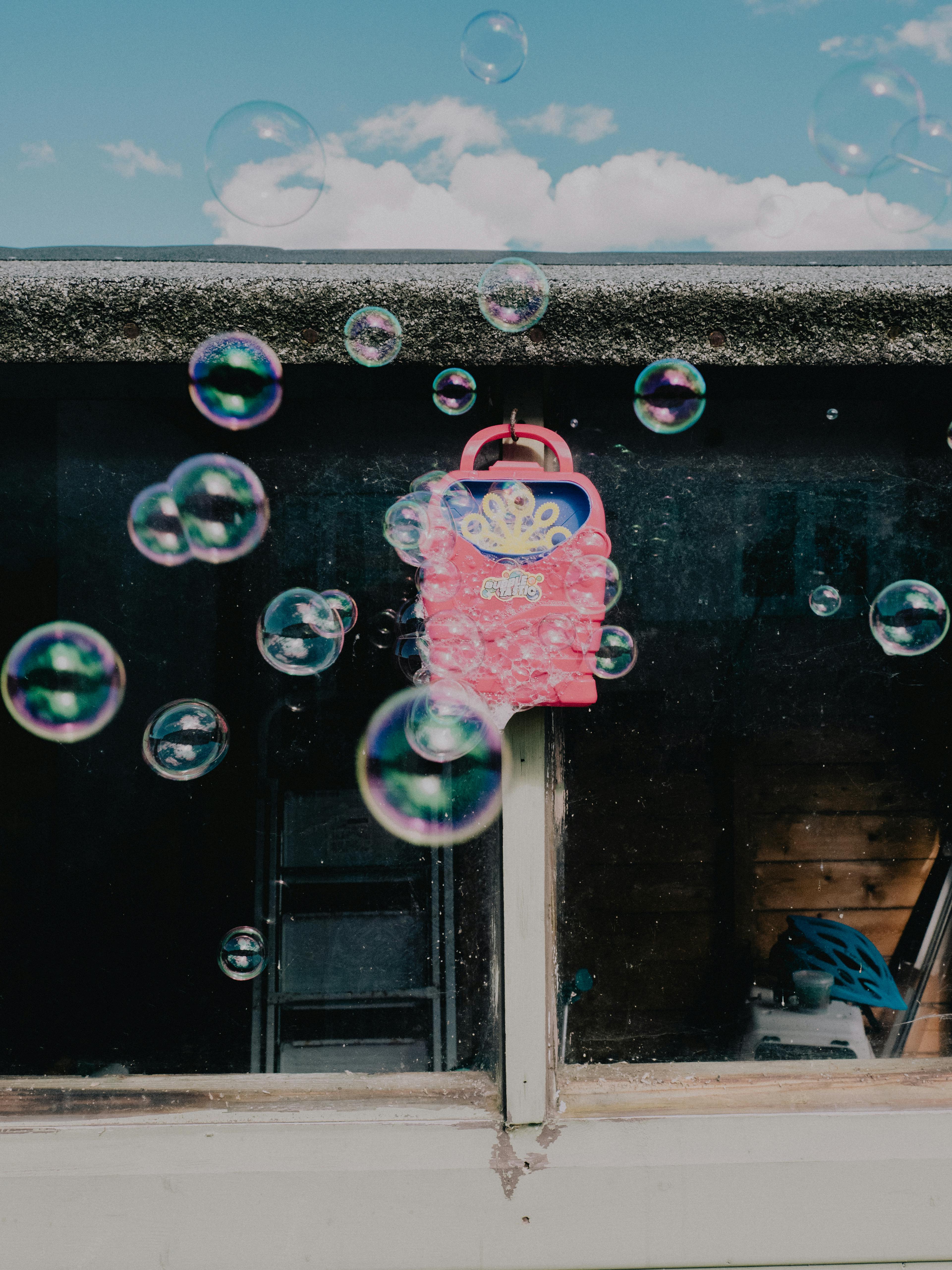 Bubbles Flying near Building · Free Stock Photo