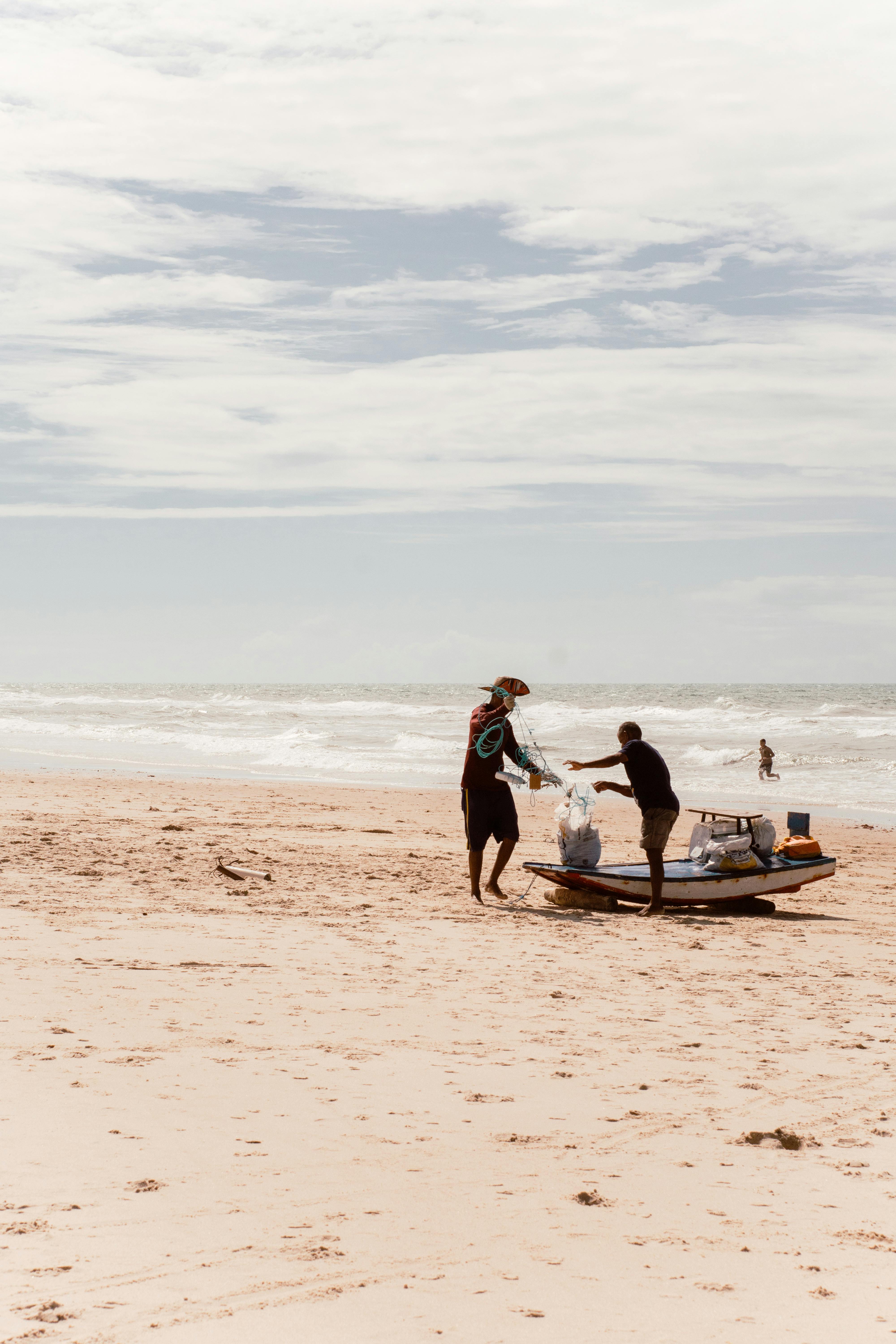 People with Motorboat on a Beach · Free Stock Photo
