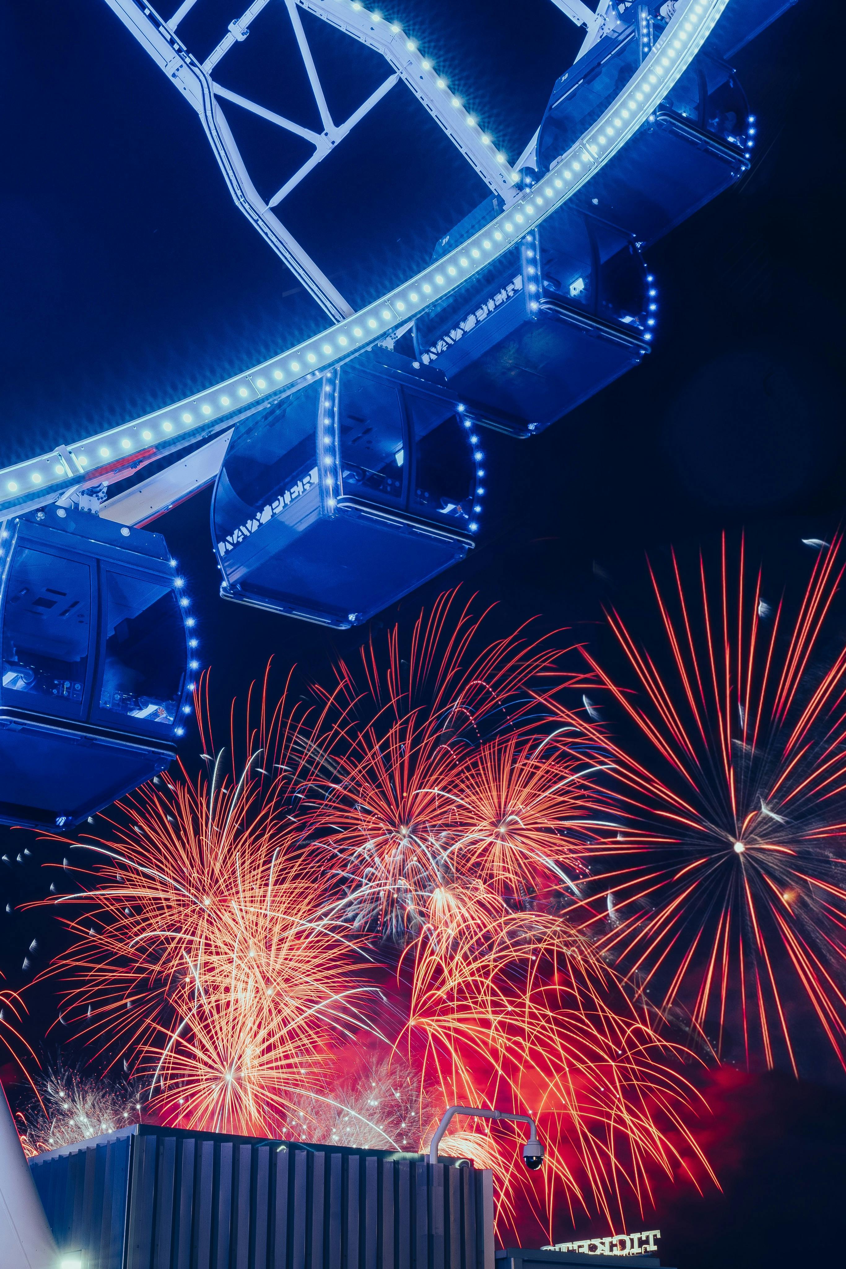 Fireworks behind Ferris Wheel at Night · Free Stock Photo