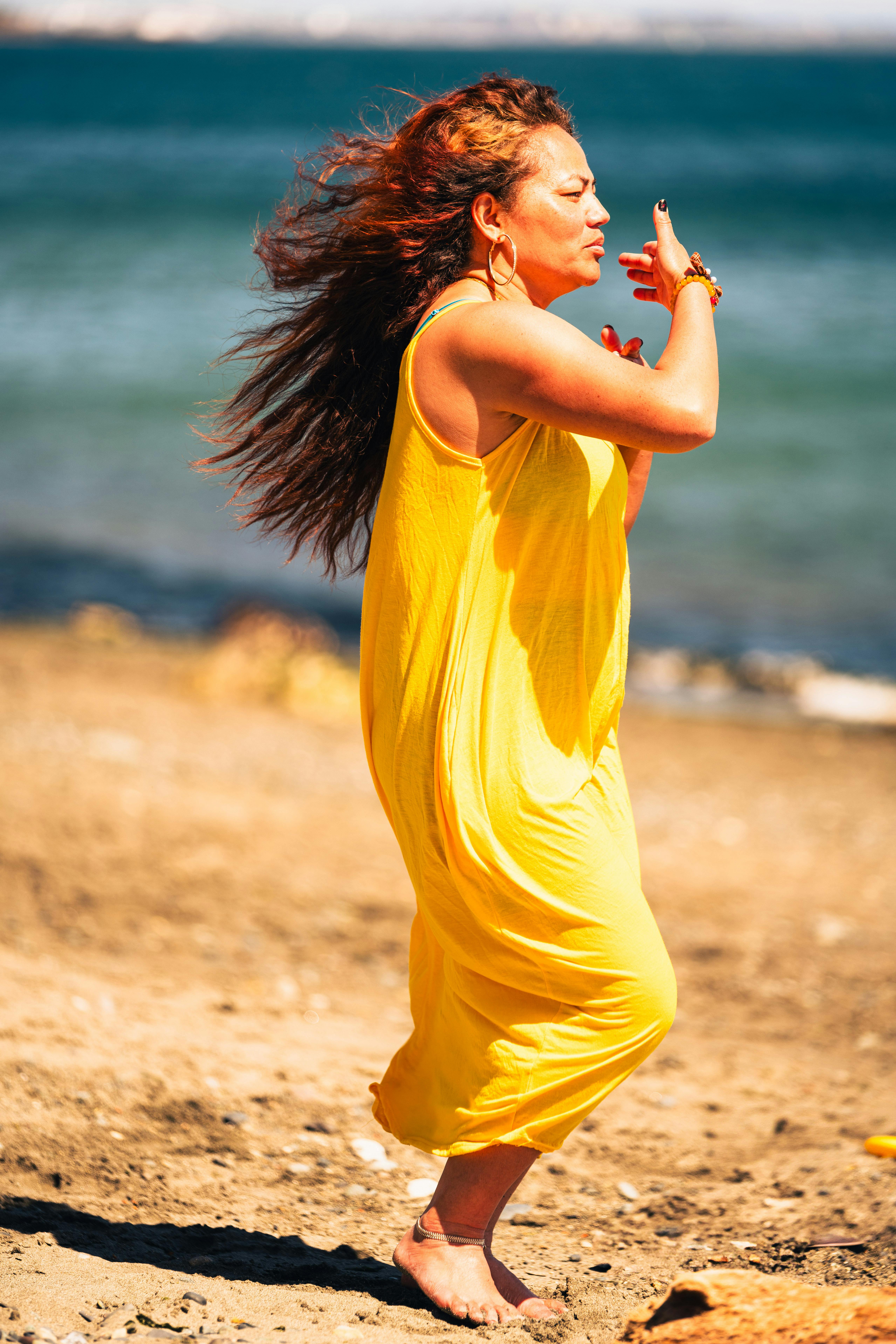Woman in Yellow Dress at Beach · Free Stock Photo