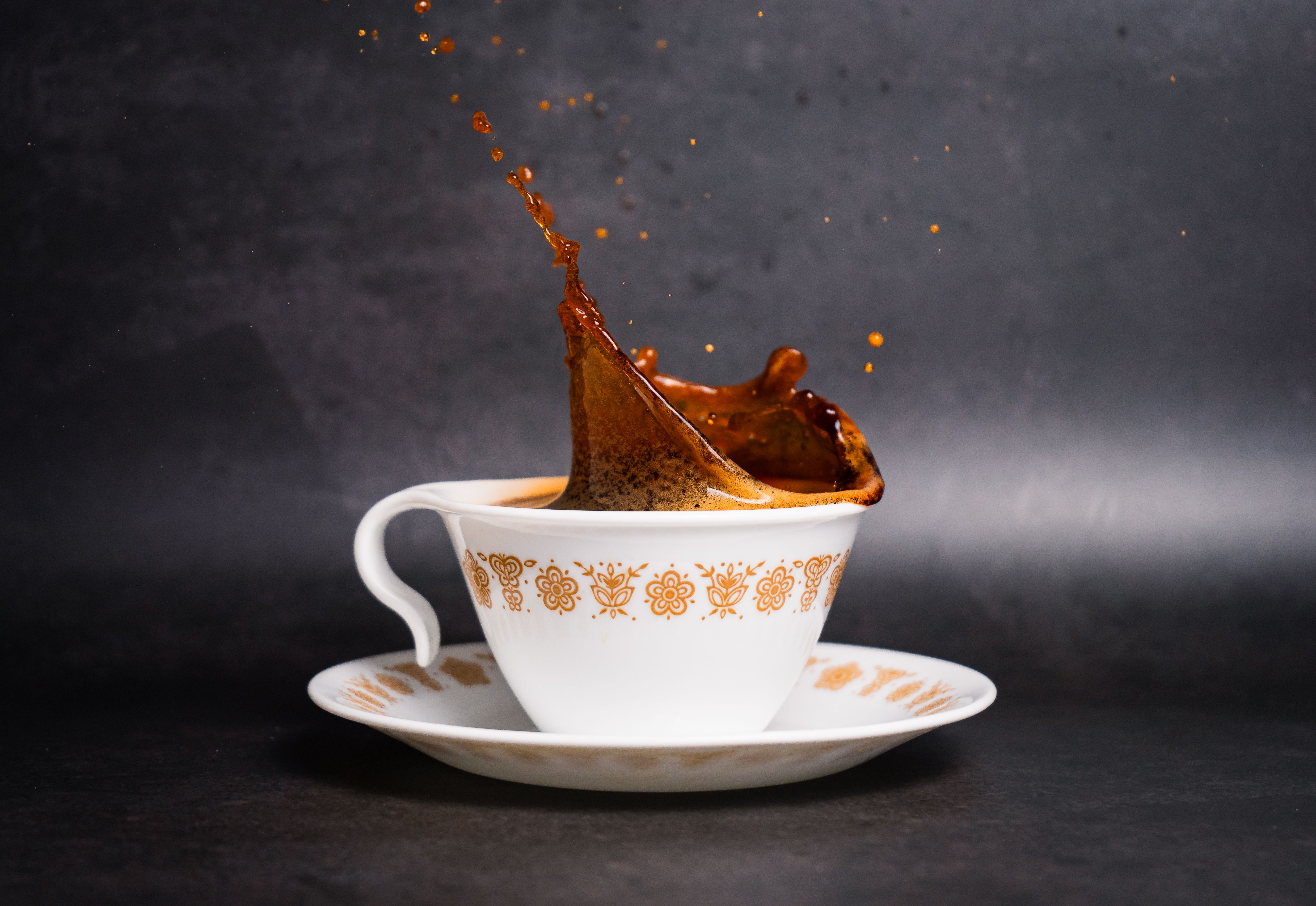Close-up of a Cup with a Splashing Coffee · Free Stock Photo