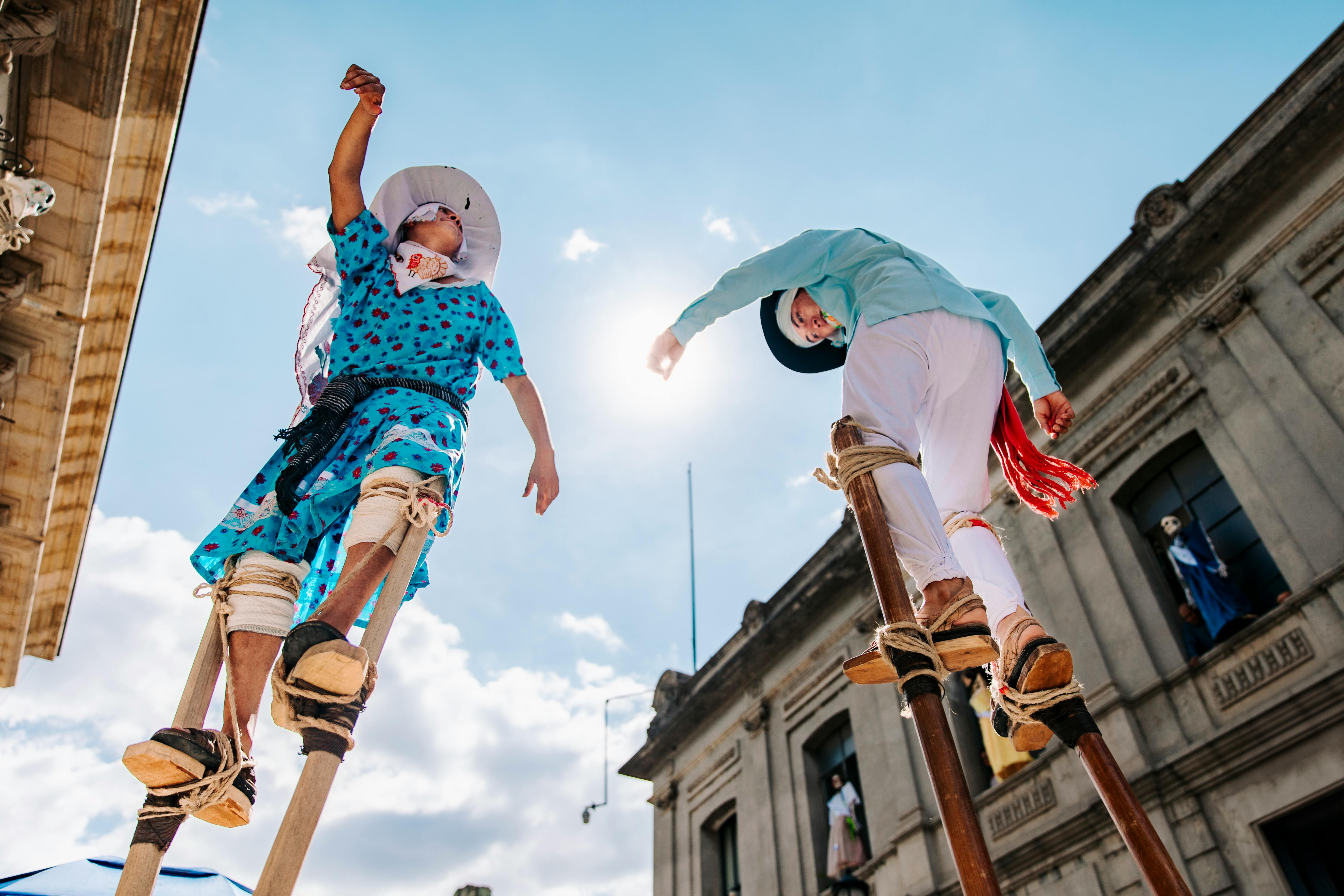 People on Stilts · Free Stock Photo