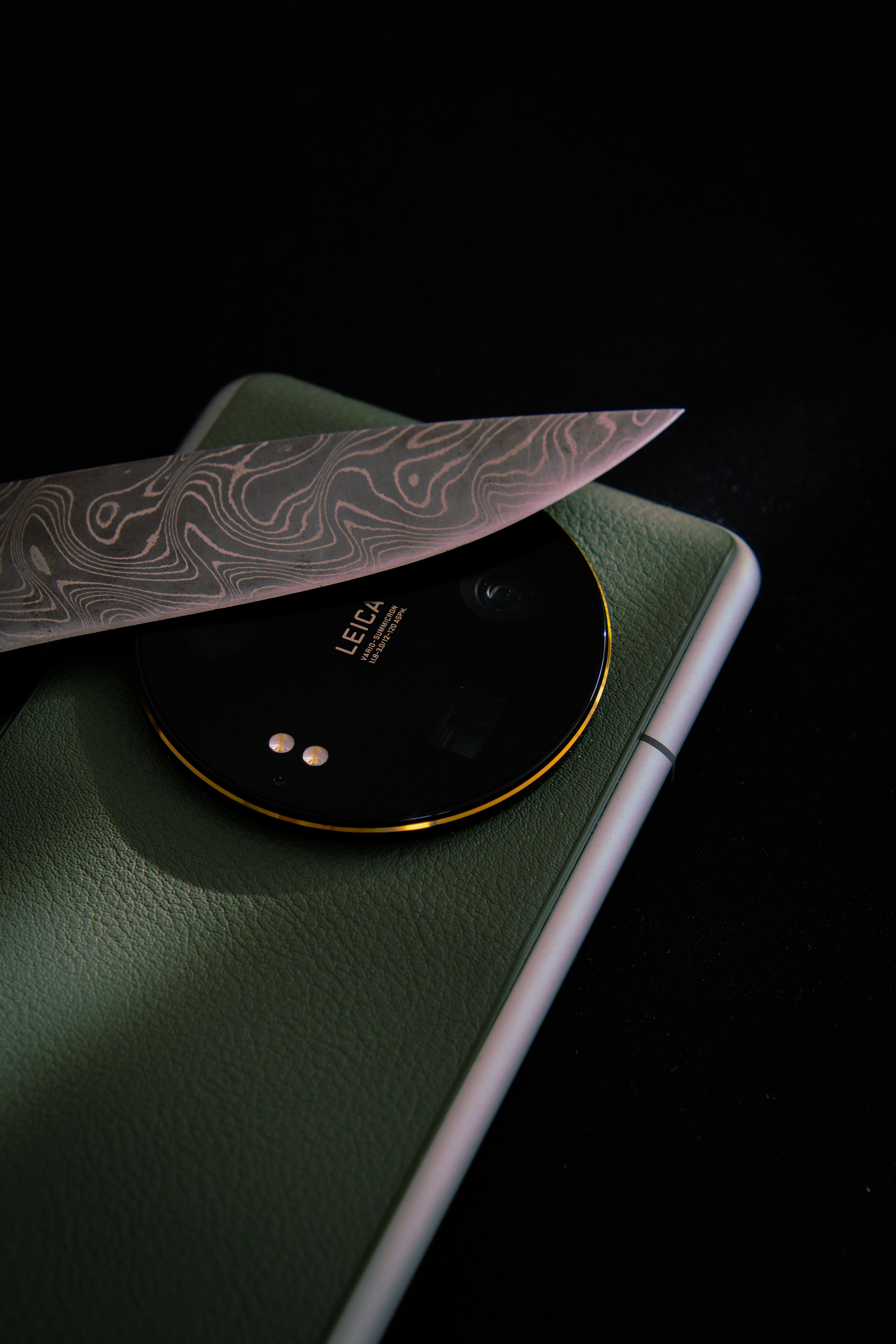 Close up of a Smartphone and a Knife · Free Stock Photo