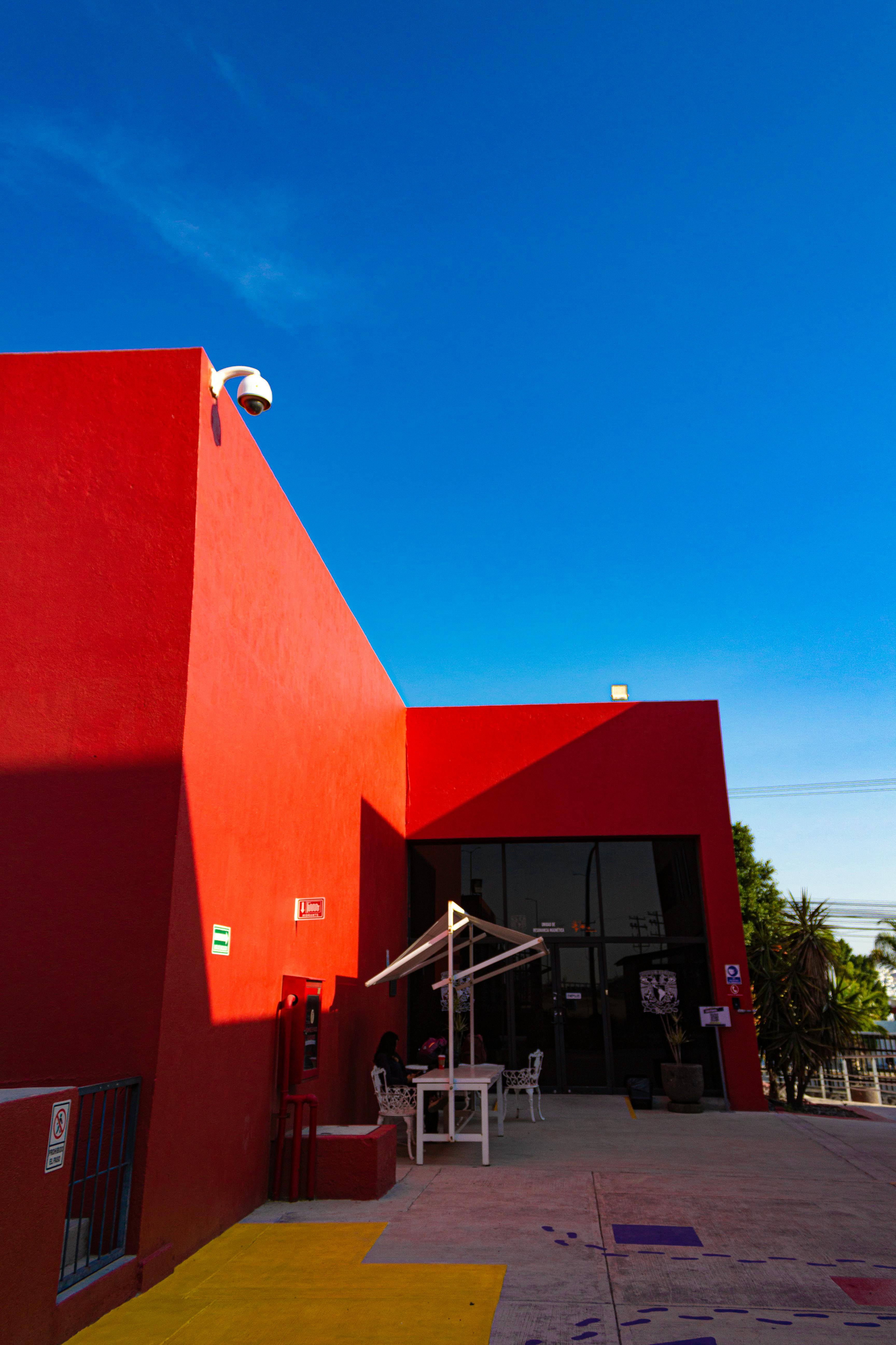 Entrance to Bright Red Building under Blue Sky · Free Stock Photo