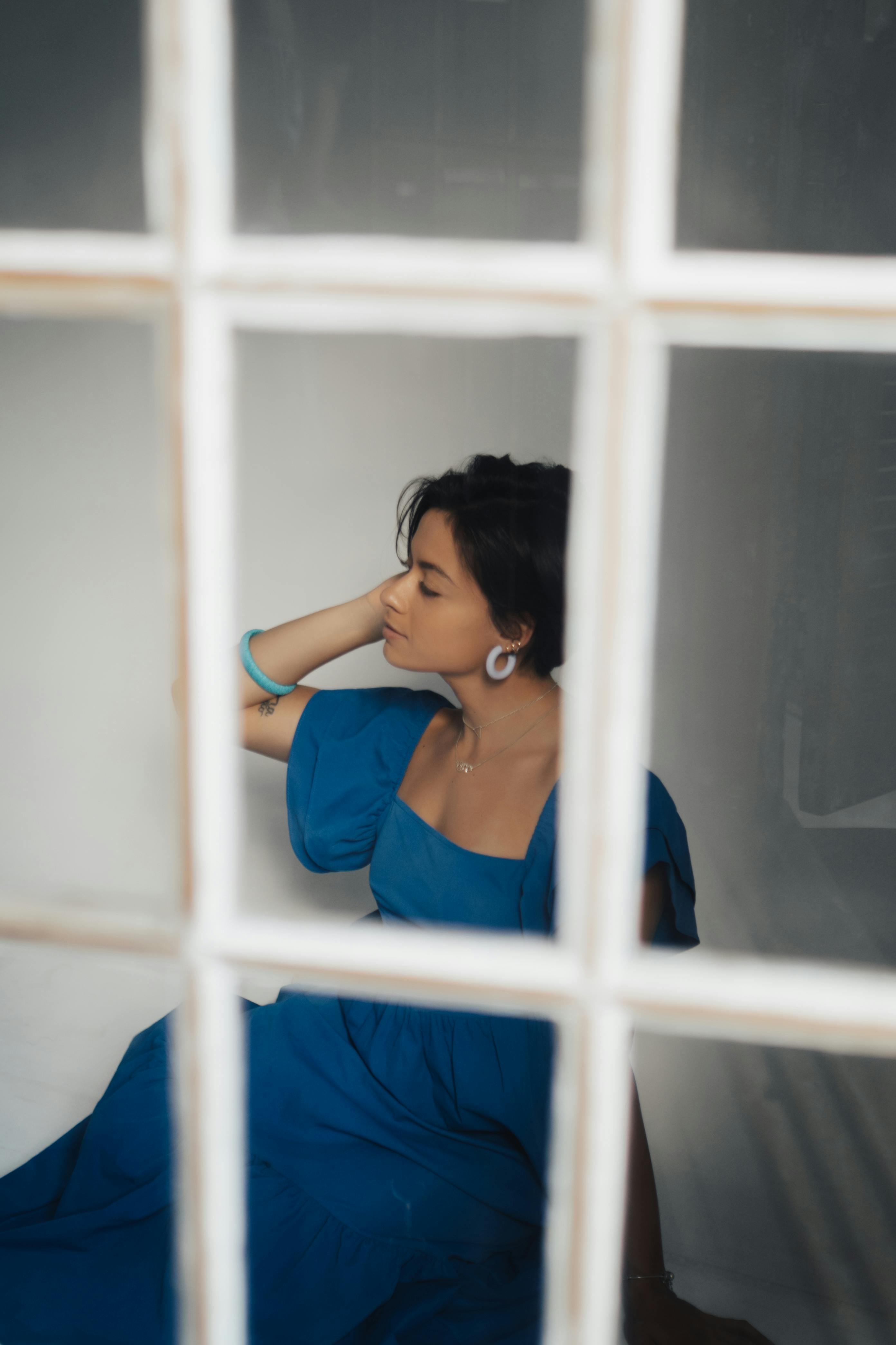 Woman behind the Window · Free Stock Photo
