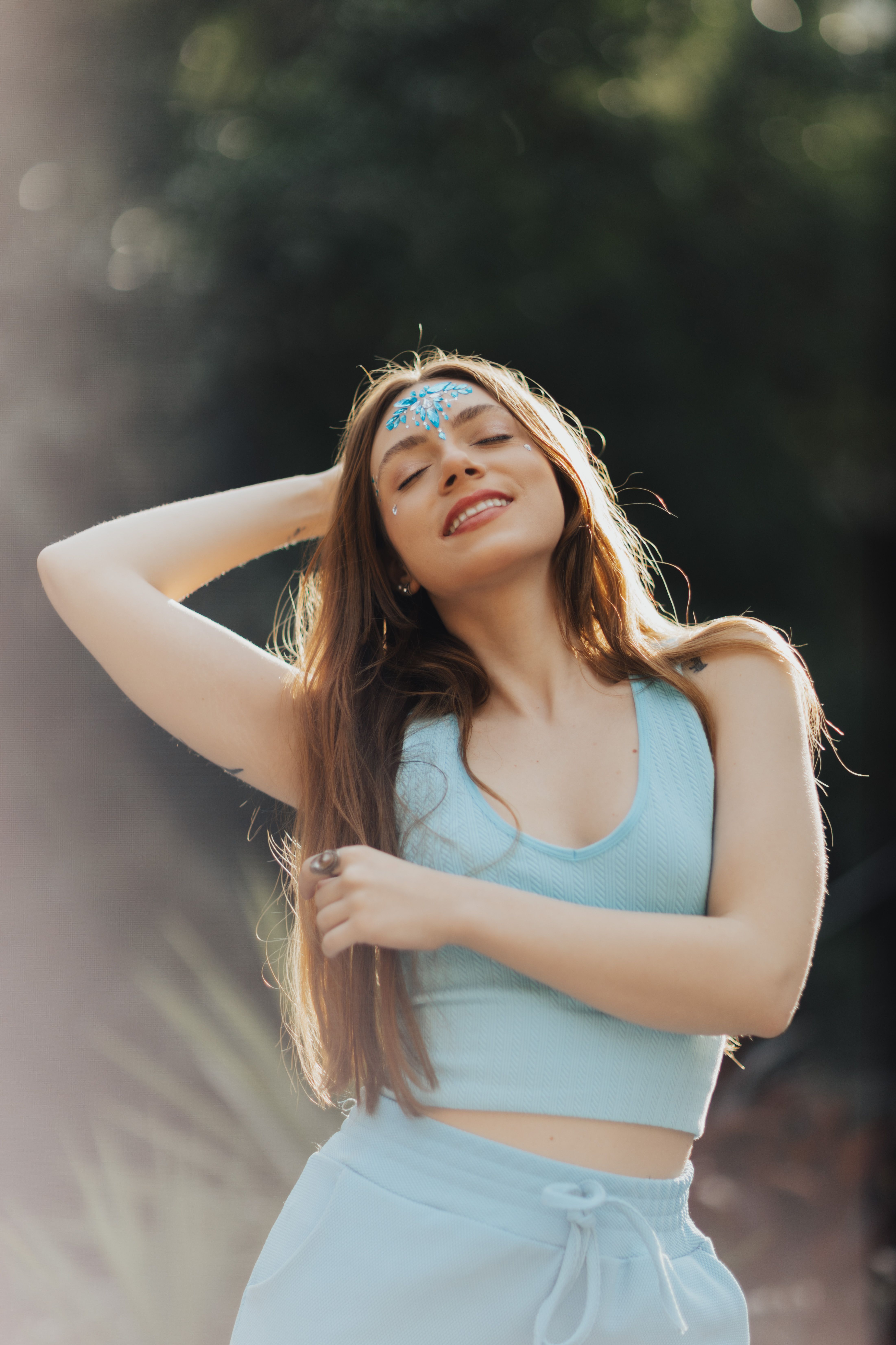 Smiling Woman in Tank Top and with Glister on Face · Free Stock Photo