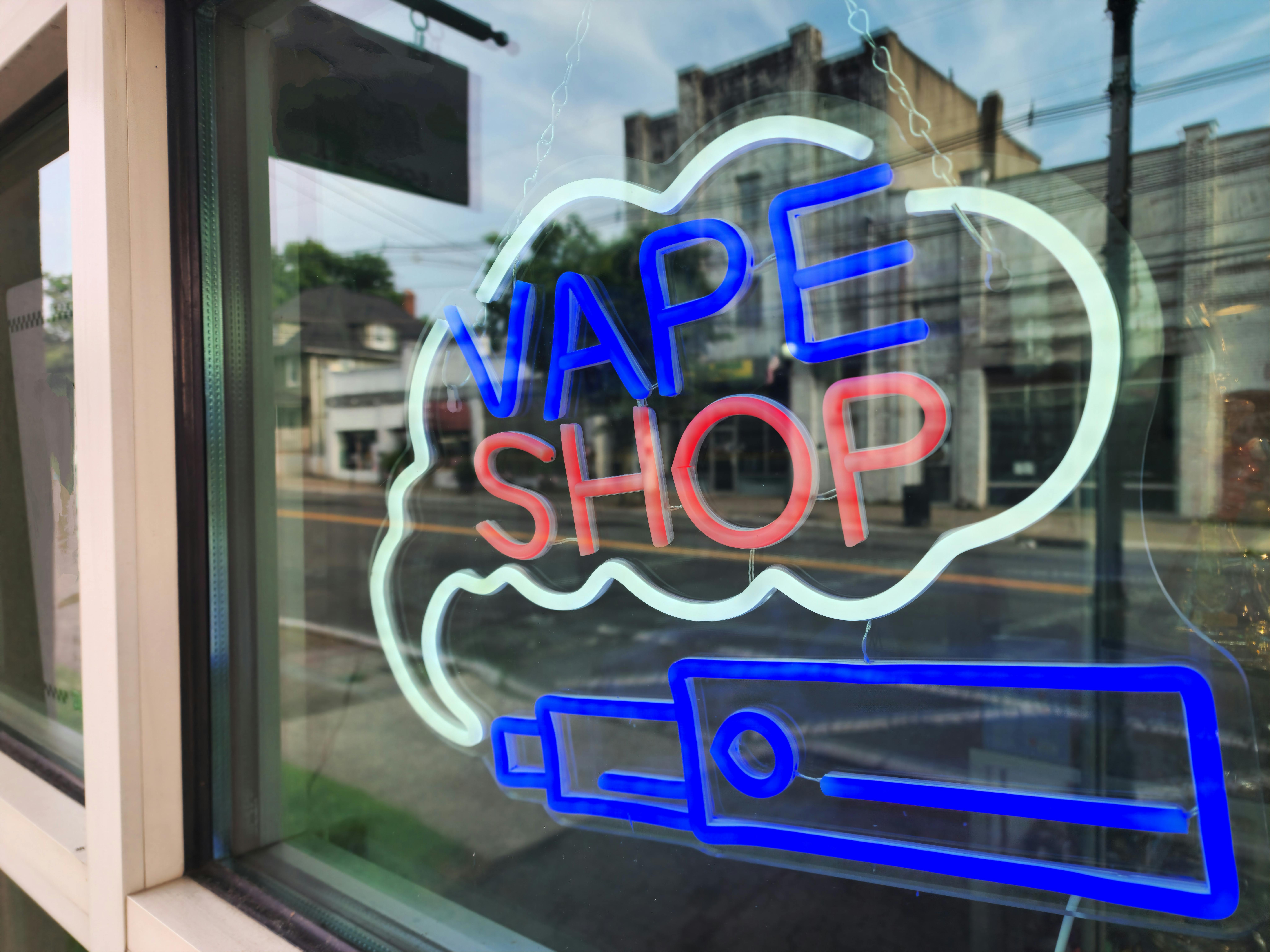 Vape Shop Logo on Window · Free Stock Photo
