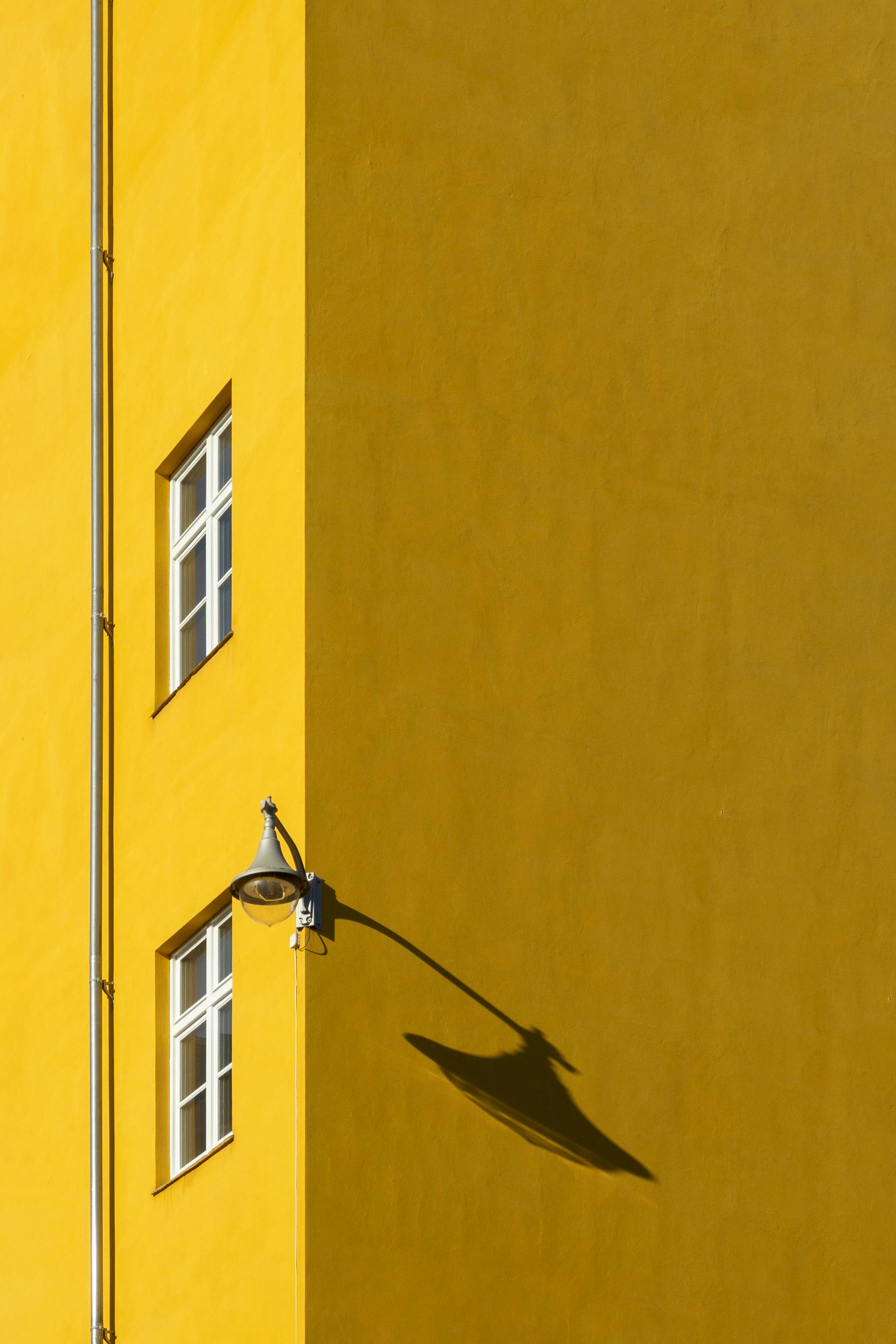 Exterior of a Bright Yellow Building in a City · Free Stock Photo